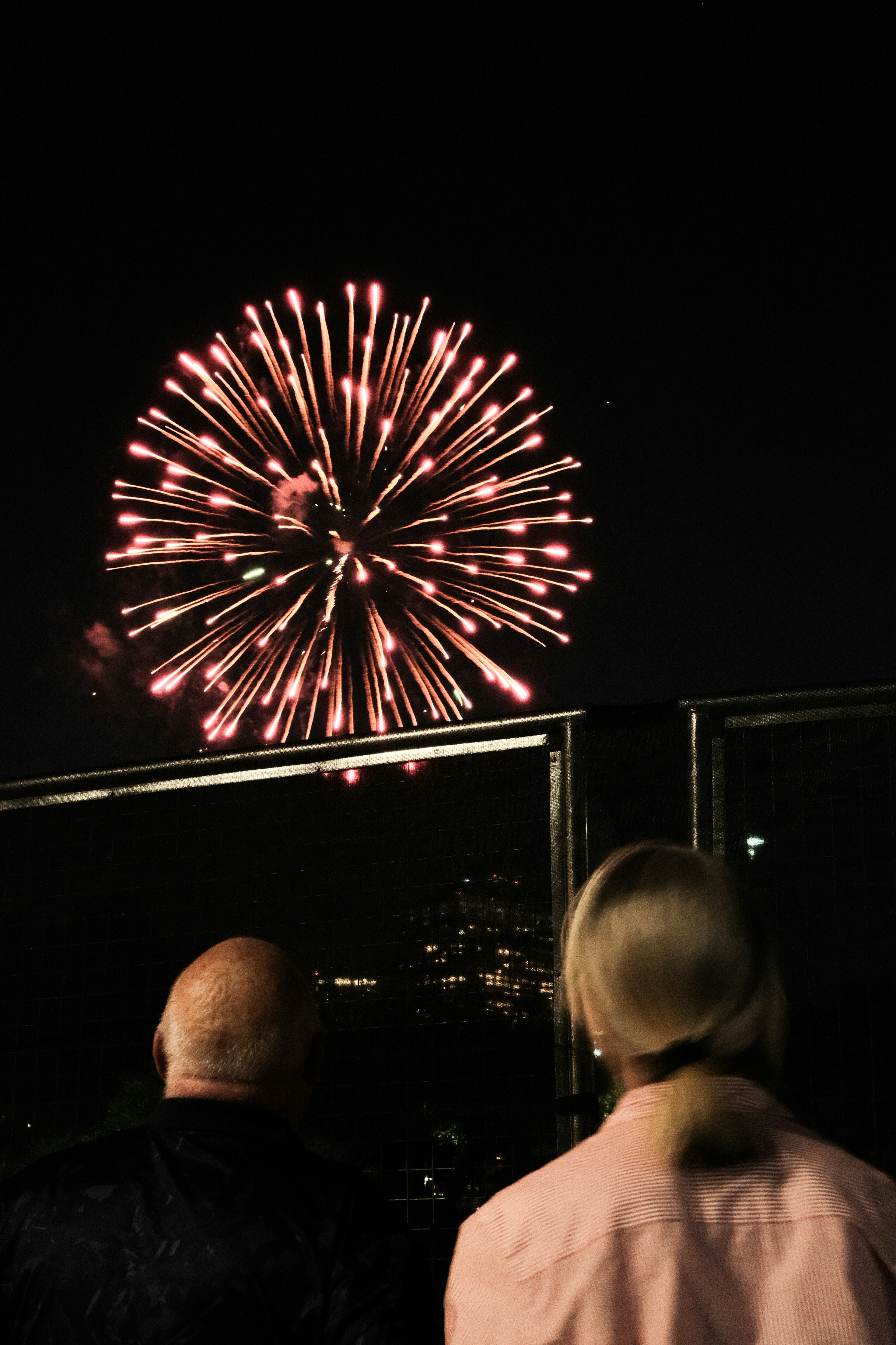 A man and a woman looking at a fireworks display photo – Free Brooklyn ...