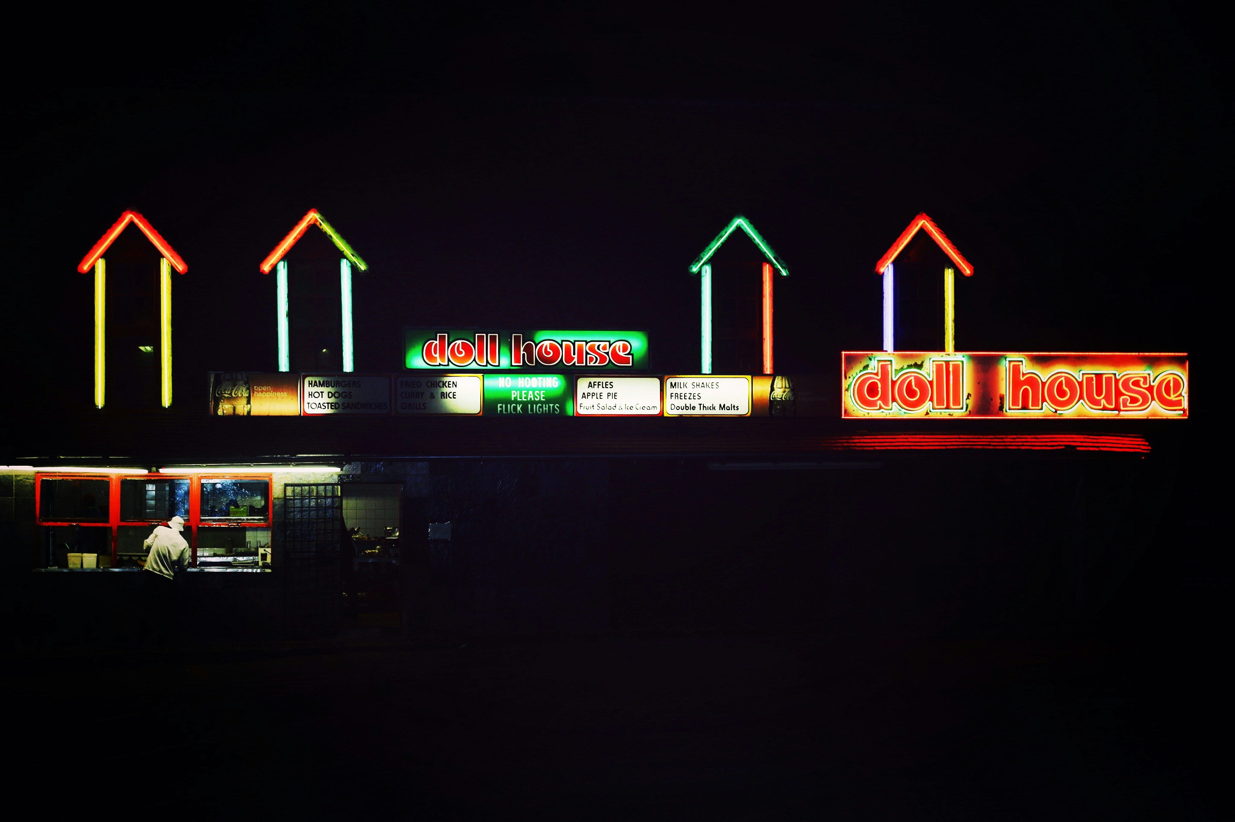 A row of neon signs lit up at night photo – Free Food Image on Unsplash