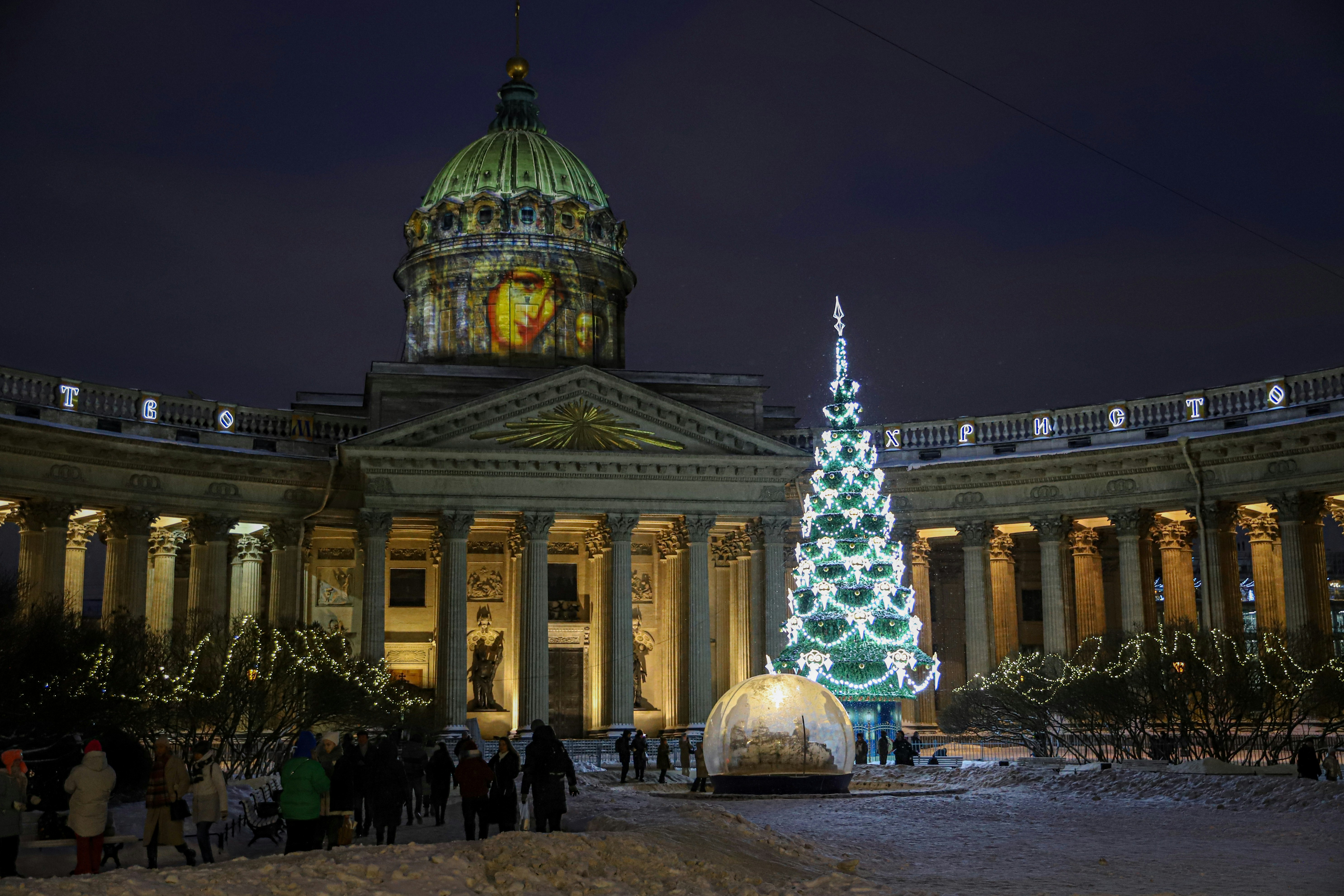 Nighttime Christmas Square: A Festive Dome Beneath the Lit Christmas Tree