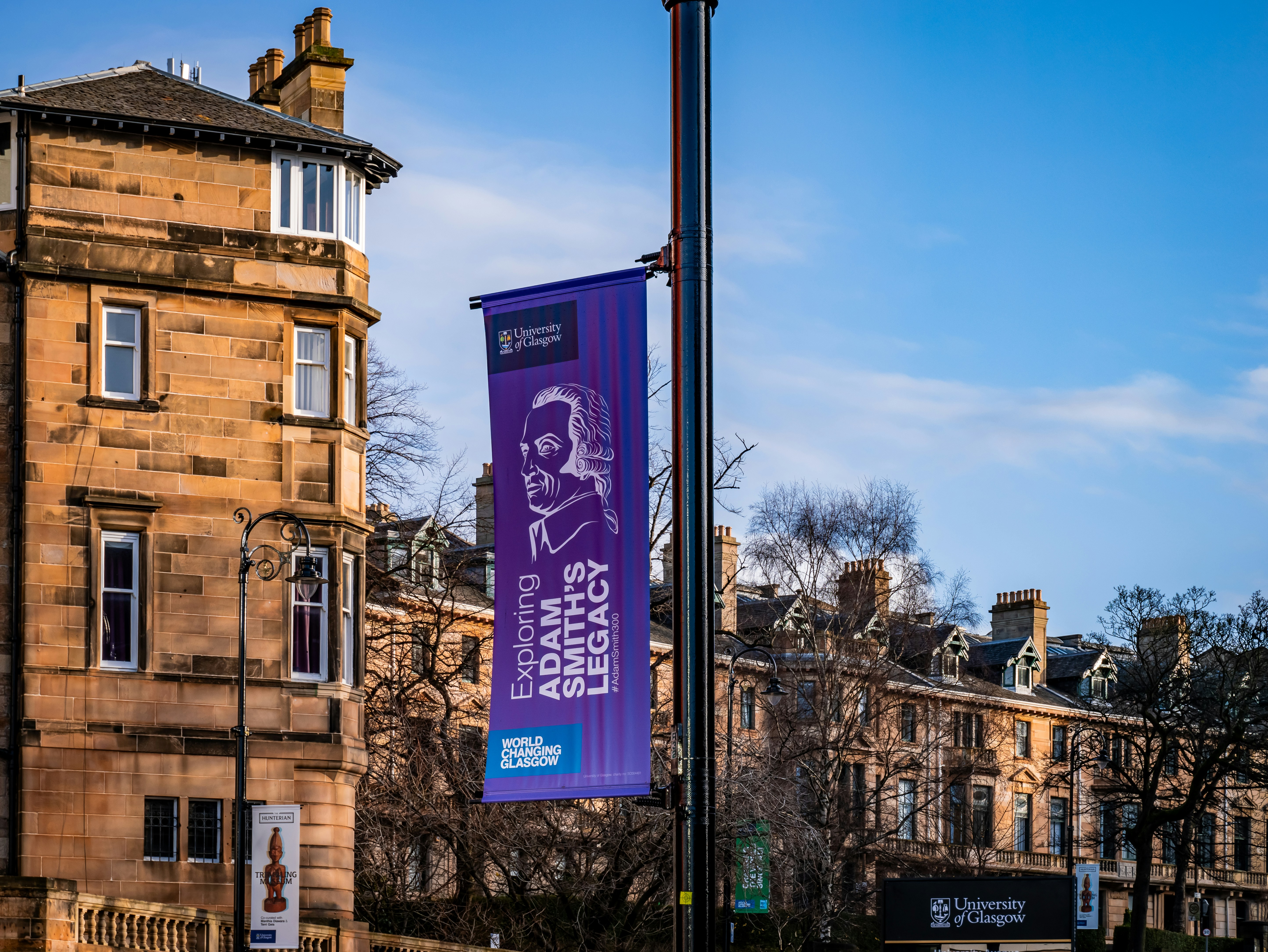 A purple banner hanging from the side of a building photo – Free Uk ...