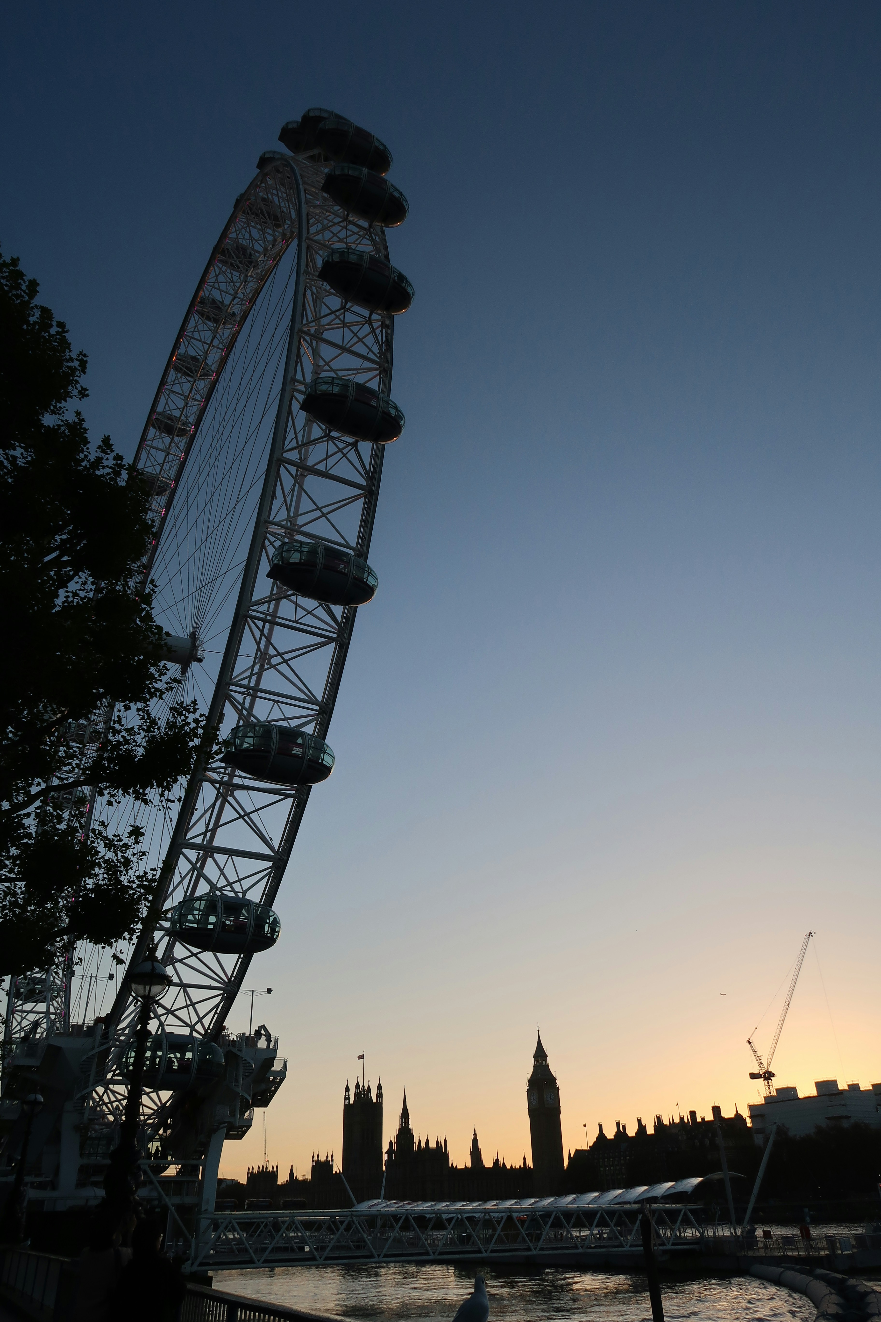 Twilight at the Thames: The London Eye Framing Westminster's Silhouette