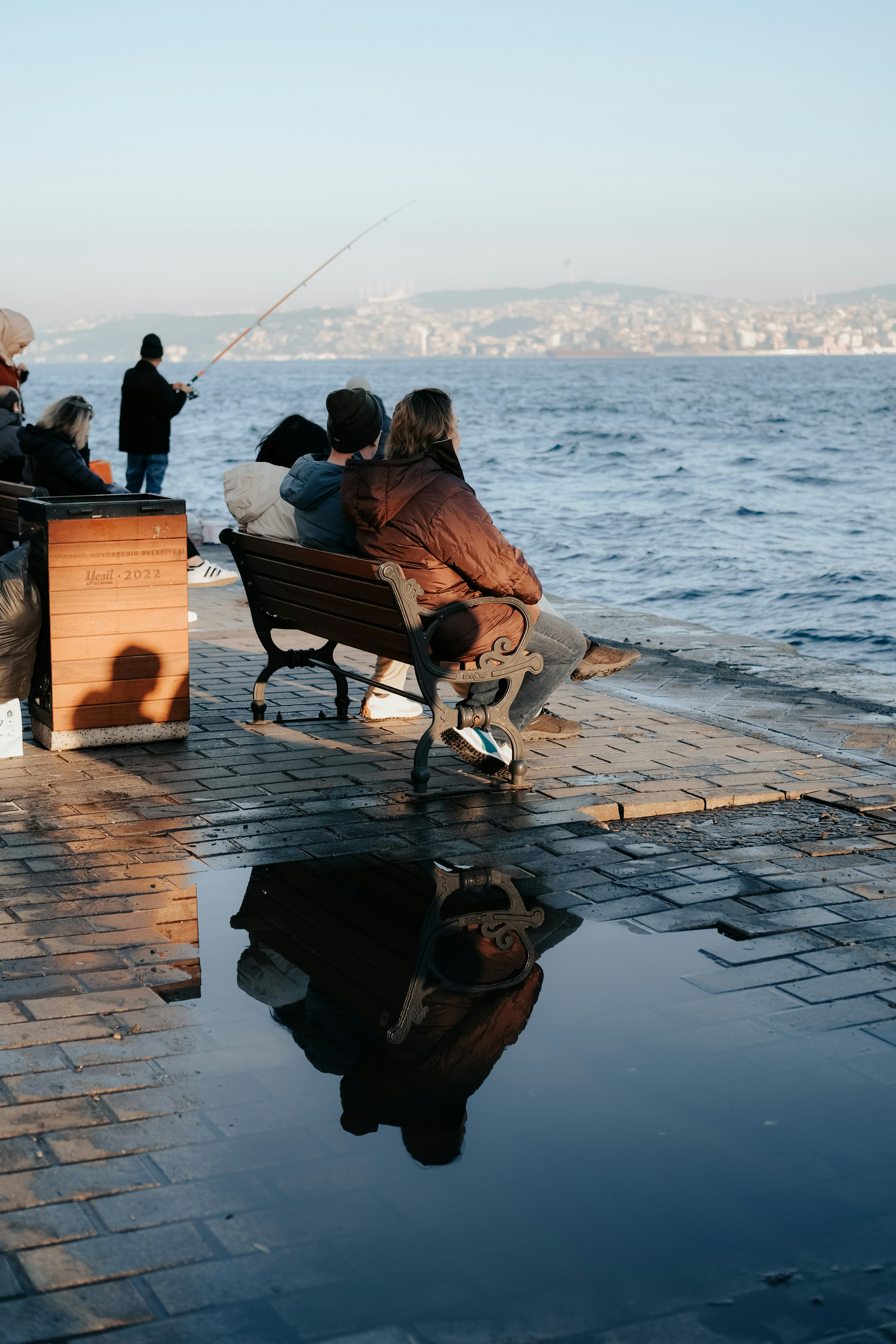 Benchside Harbor: Reflections and Waiting by the Sea