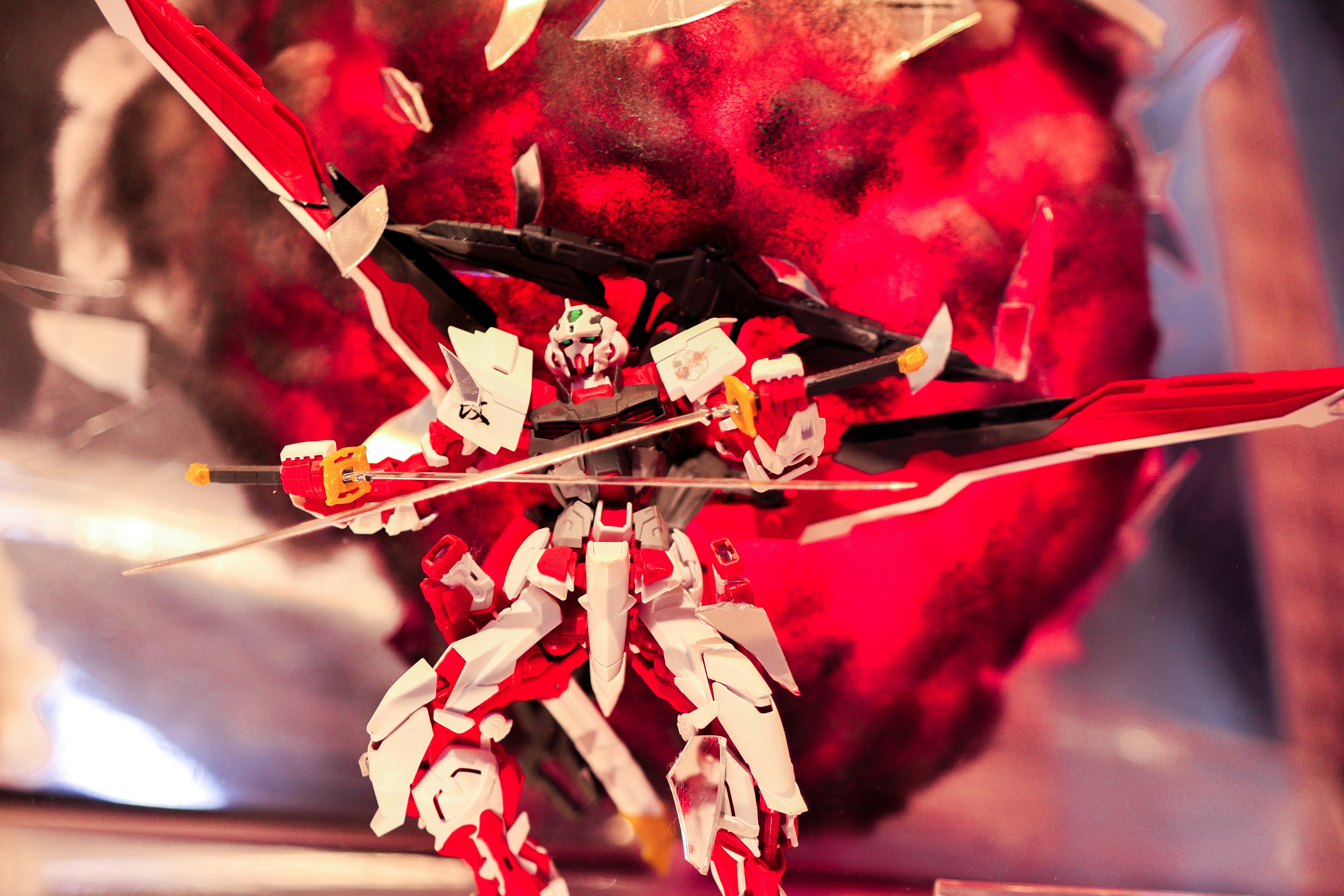 A close up of a model of a red and white robot photo – Free Anime Image ...