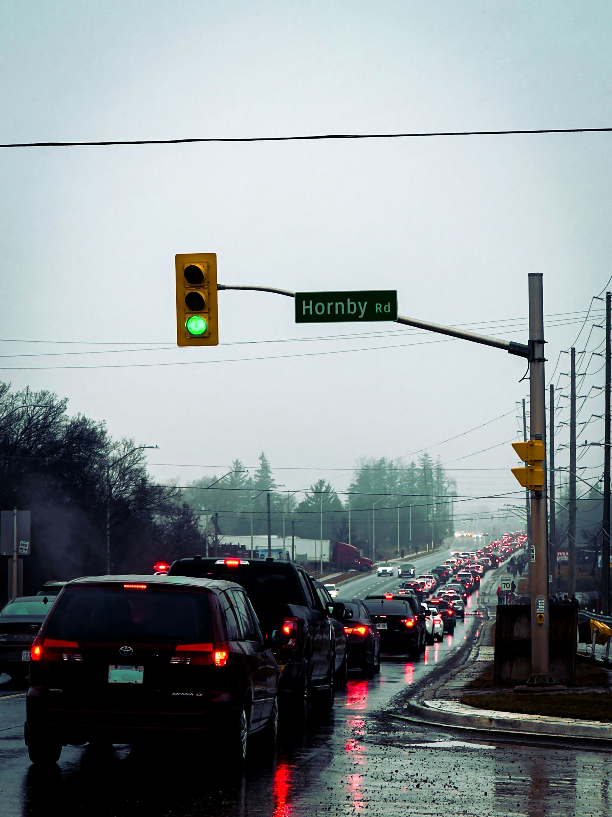 Green Light Over a Rainy Street: Traffic Queue at Hornby Road