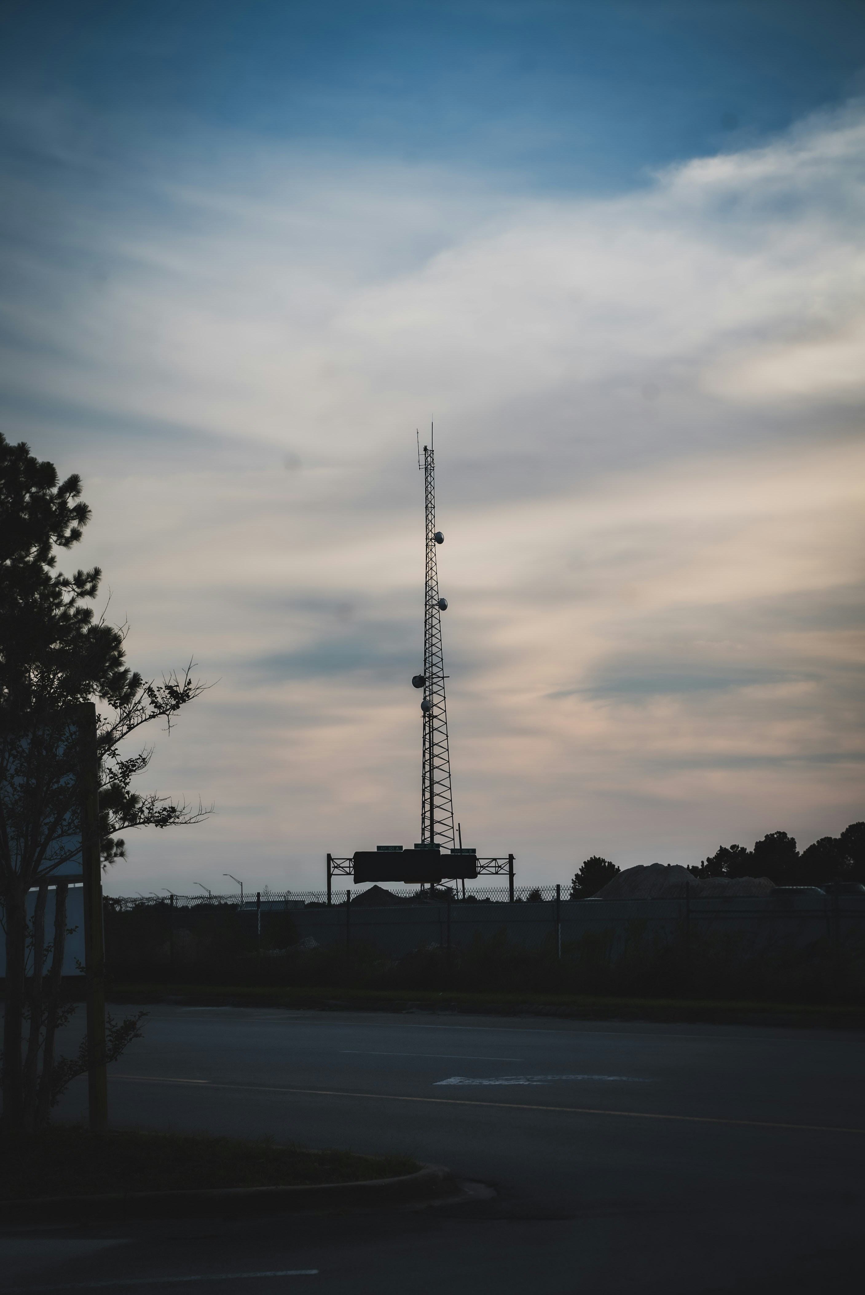 Vertical Signal at Dusk: A Lone Tower Carved from Pastel Sky