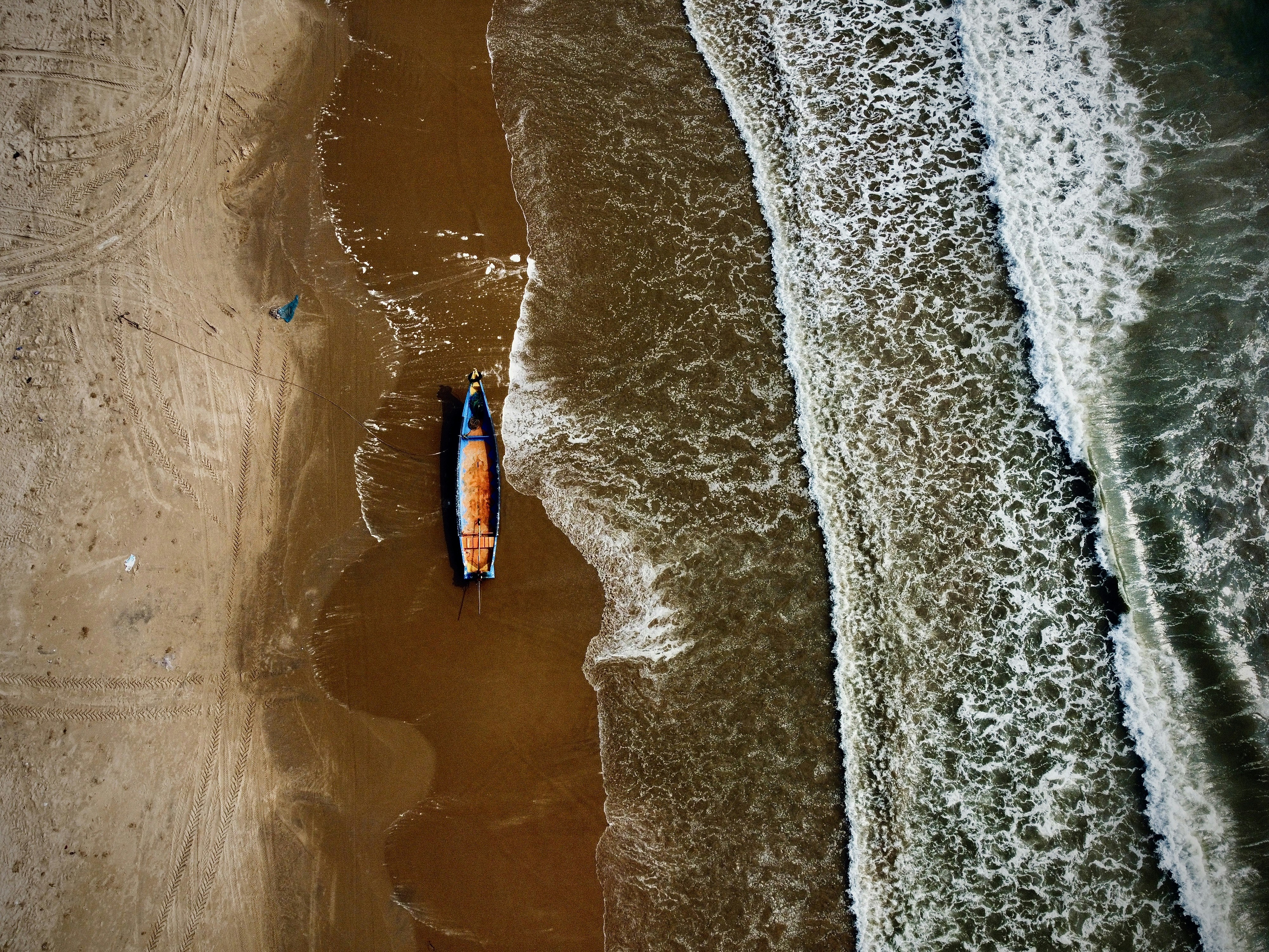 An aerial view of a boat on the beach photo – Free Chirala beach Image ...