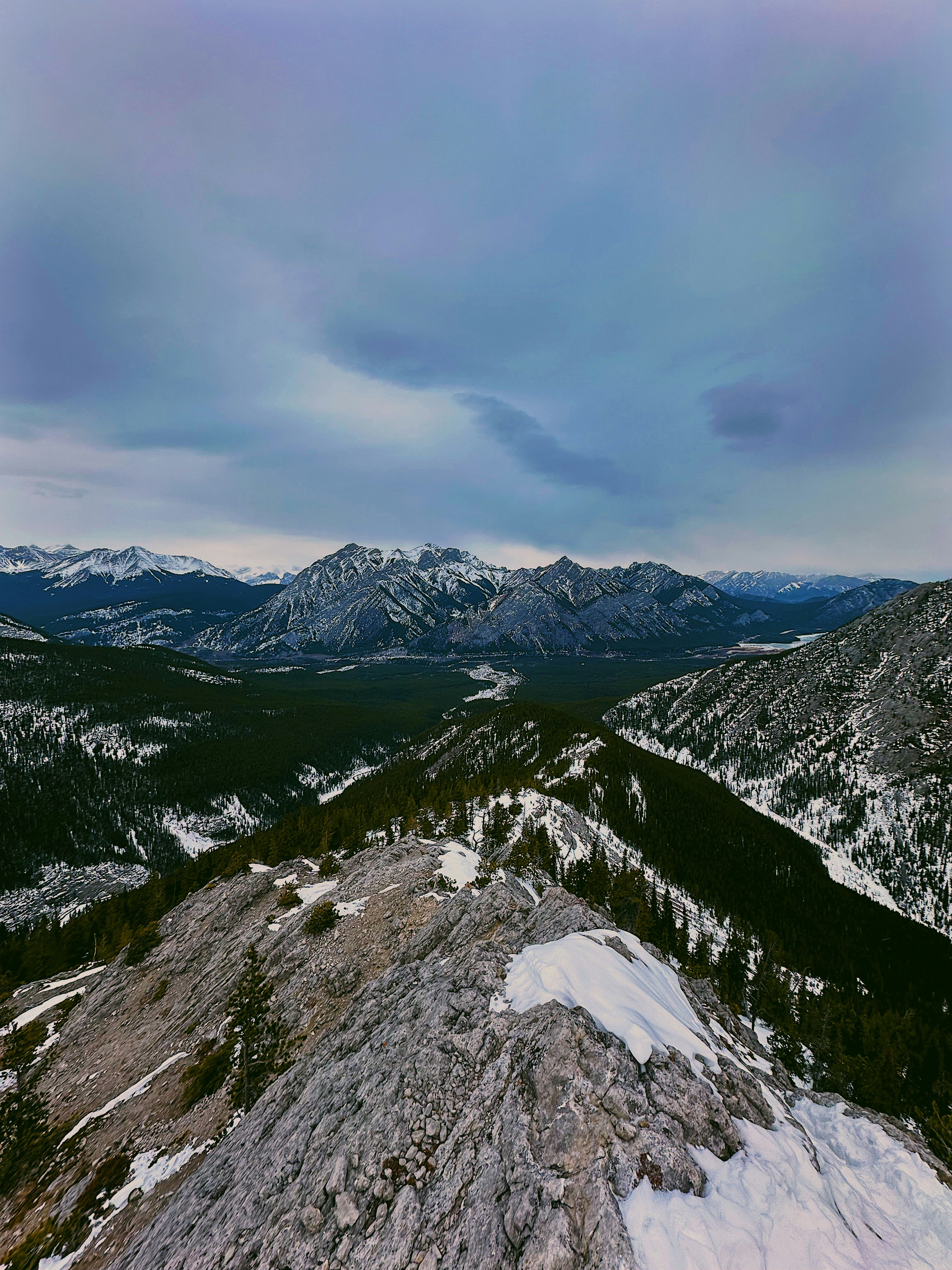 Snow-Dusted Spine of the Range Beneath a Moody Alpine Sky