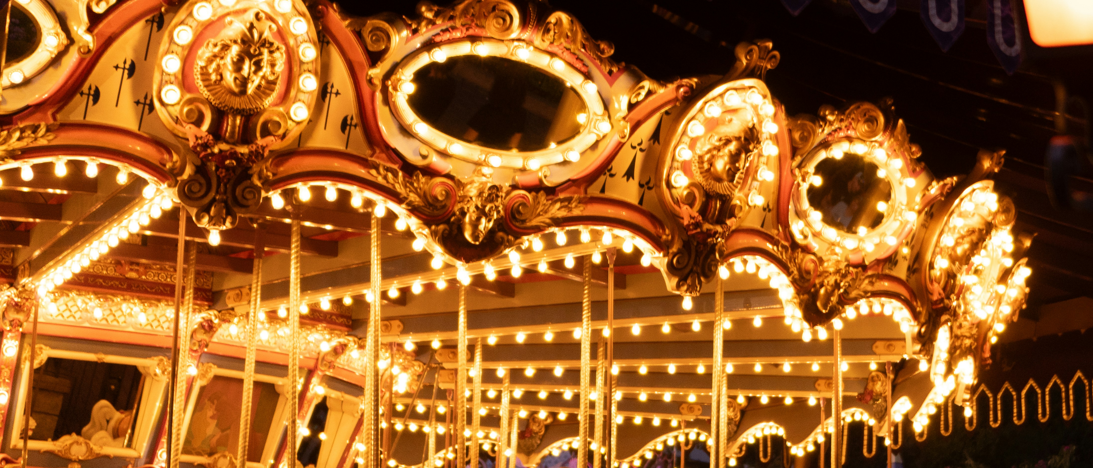 A merry go round with lights and mirrors photo – Free Disneyland park ...