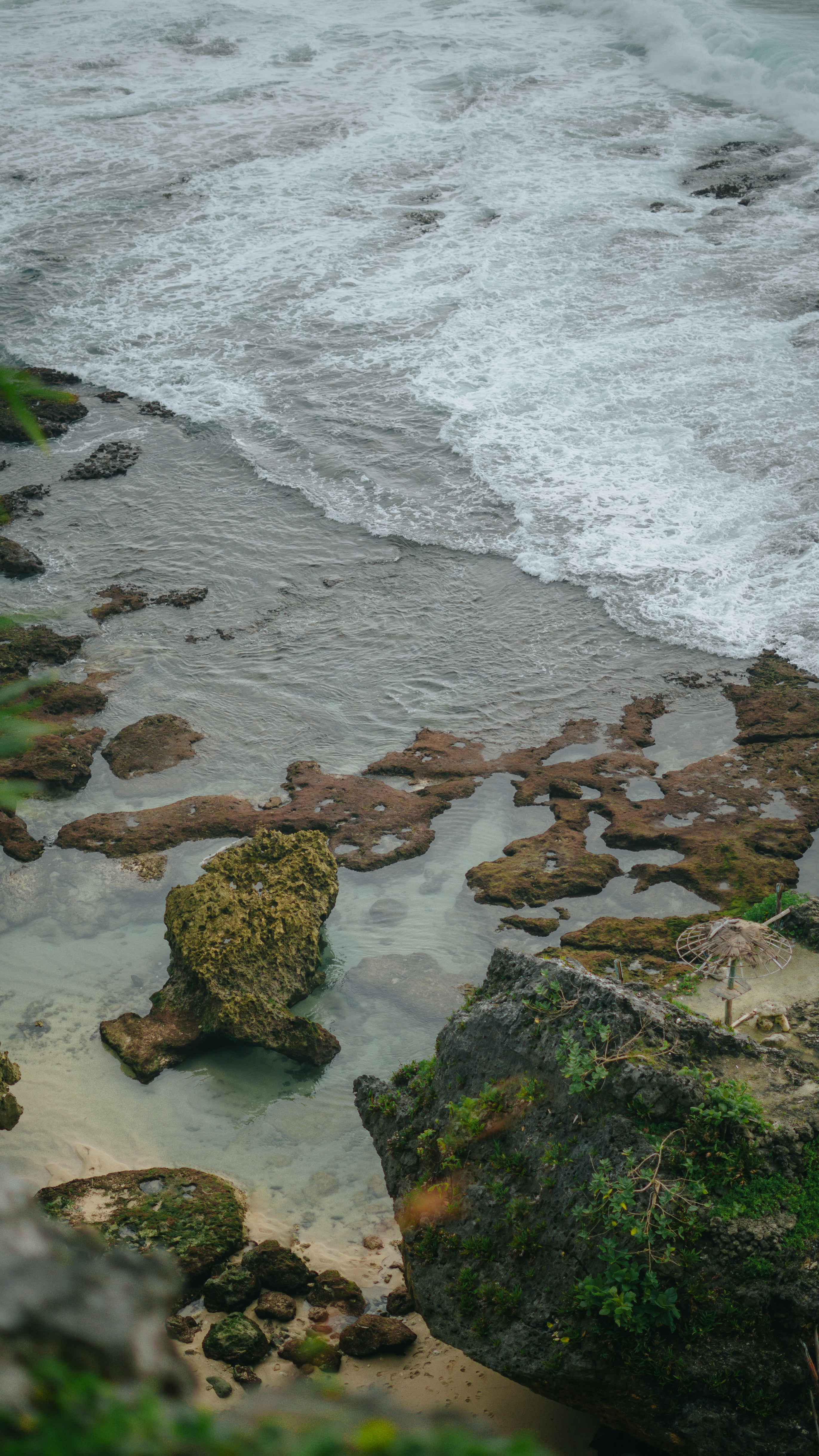 sea ​​view from above, visible coral on the beach