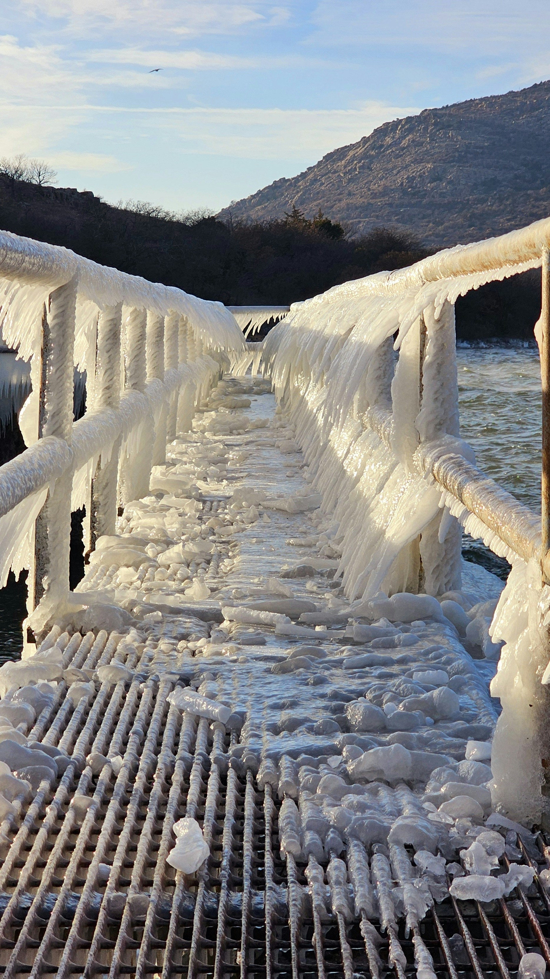 Vanishing Lines on a Frosted Pier Toward a Snowbound Horizon