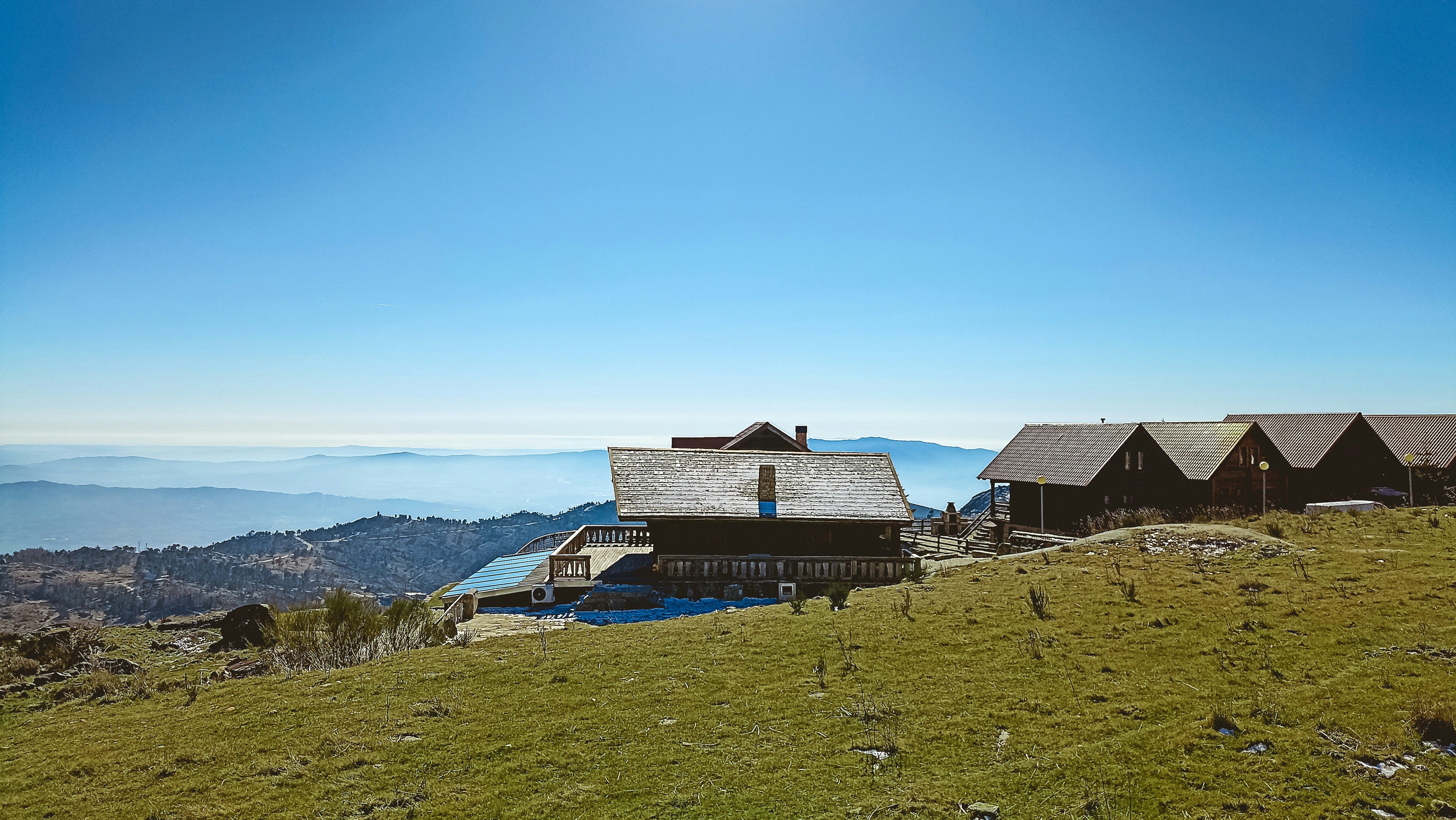 Huts on a High Ridge under a Clear Sky