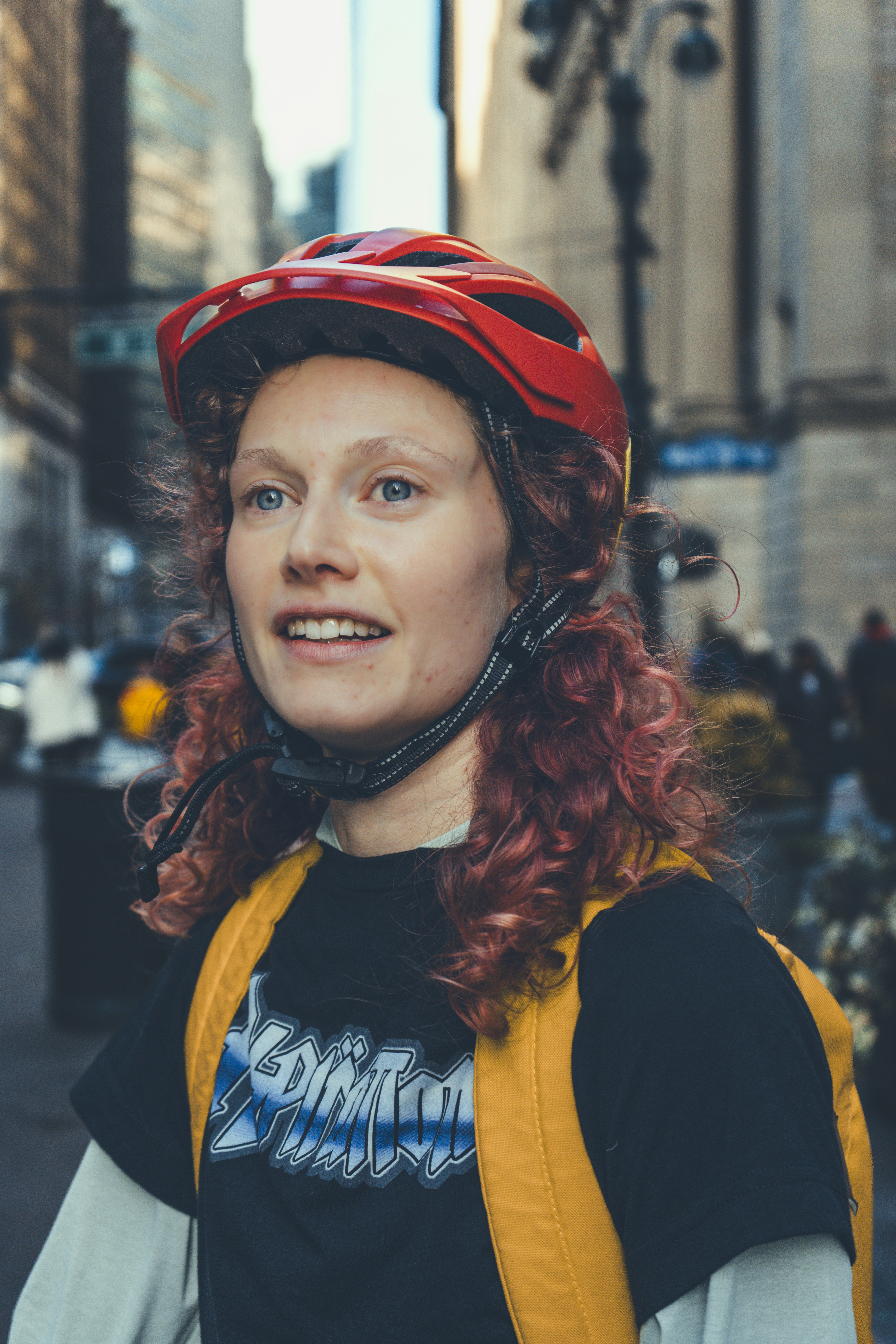 Red-helmeted Cyclist in Urban Blur