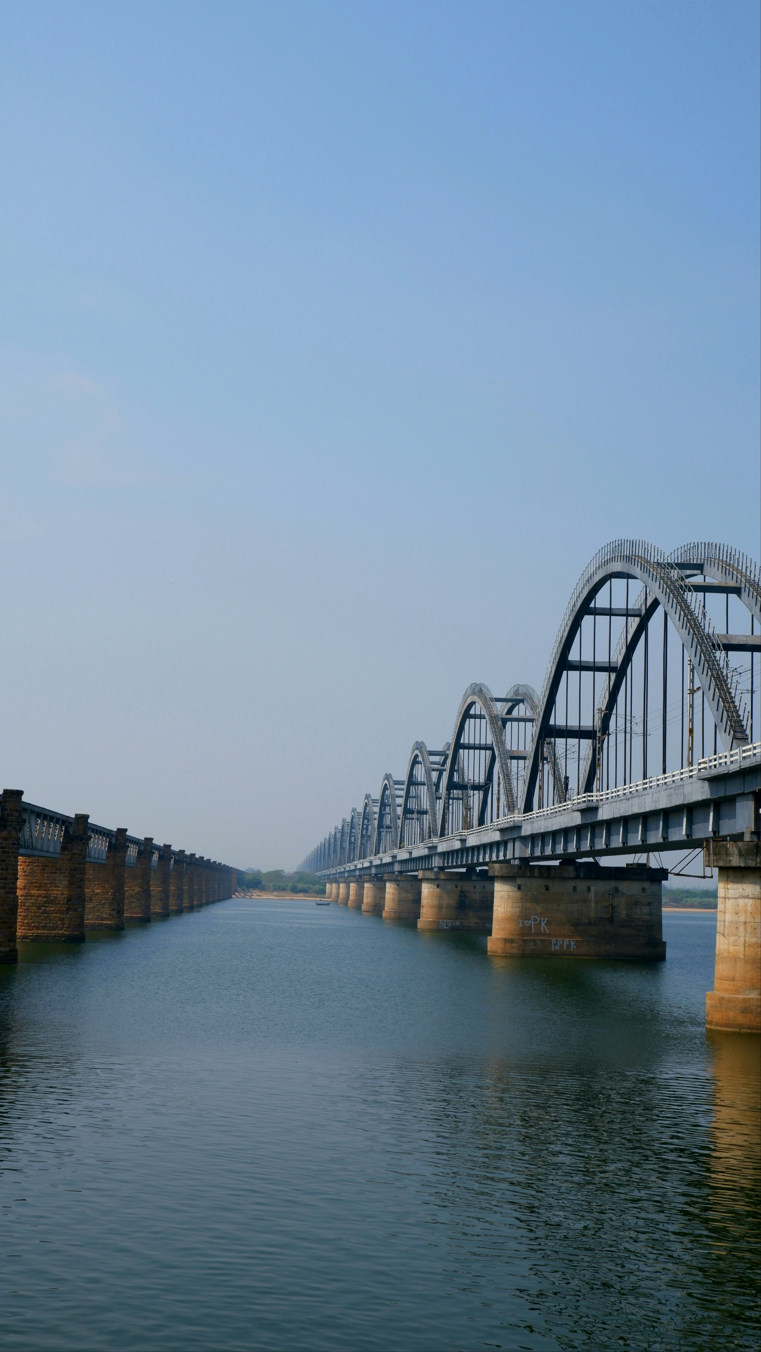 A long bridge over a large body of water photo – Free River Image on ...