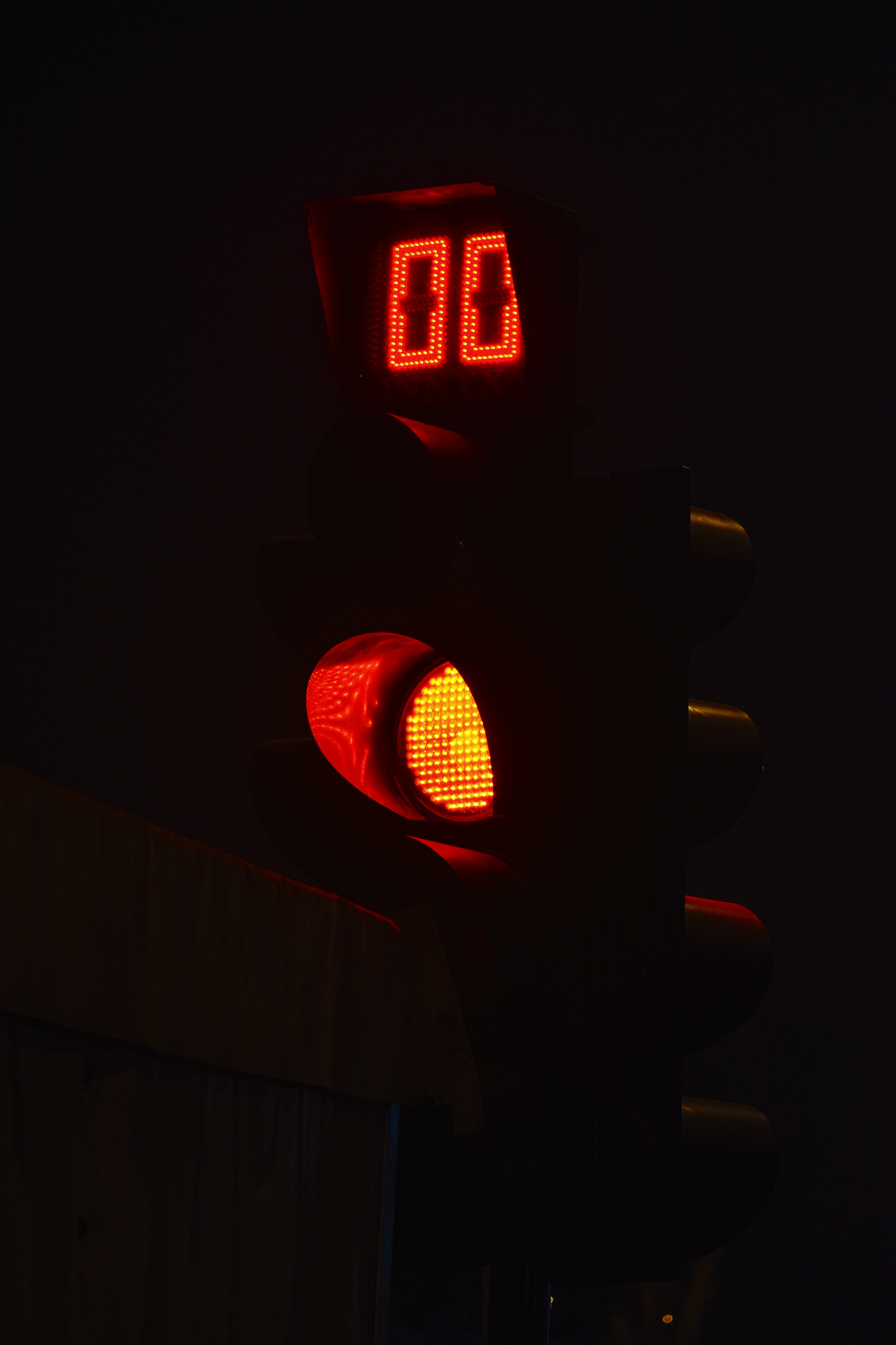Red Glow at Night: The Quiet Countdown of a Traffic Signal