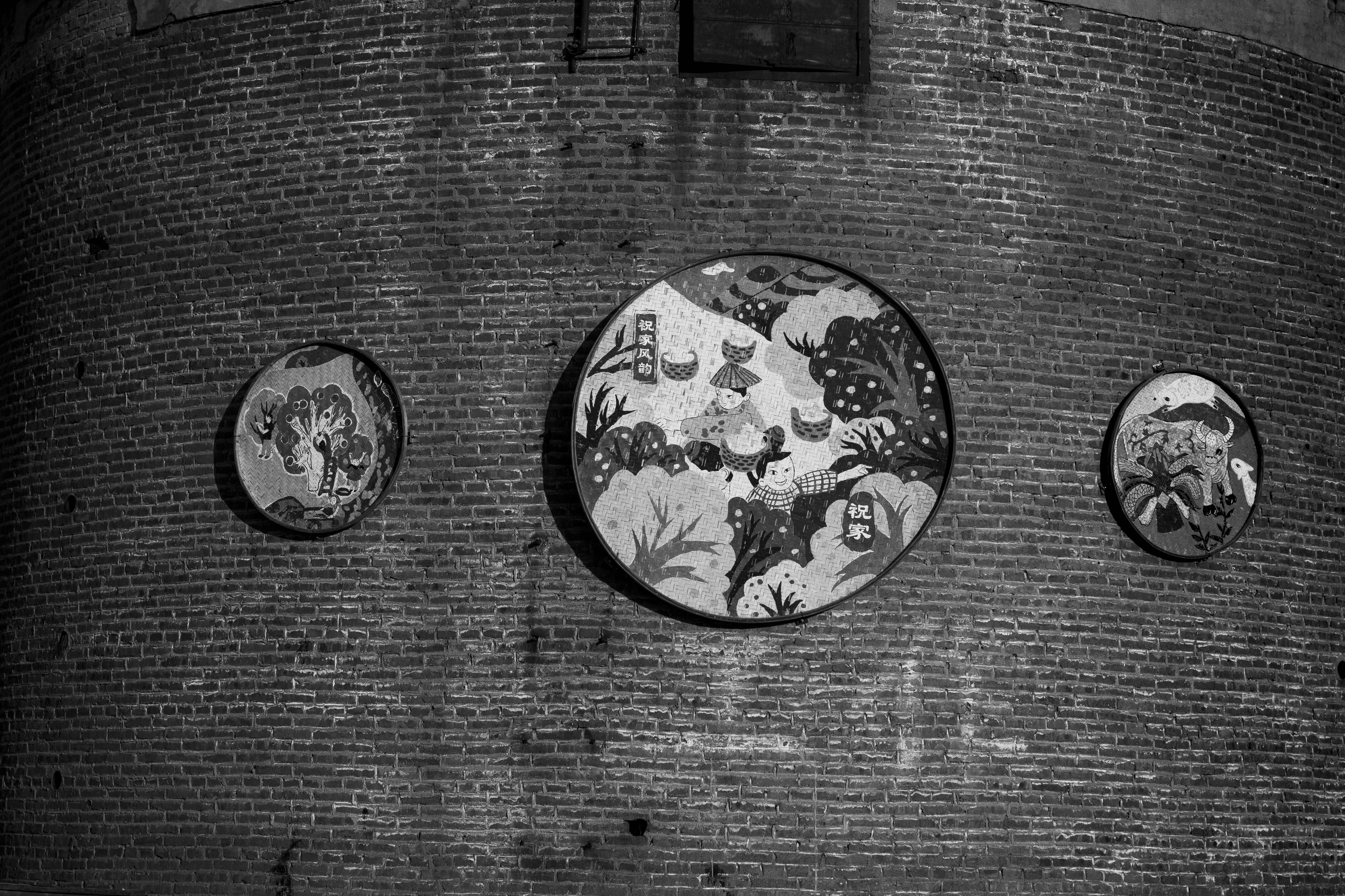 Center Circle Mosaic: Undersea Fragments in a Brick Facade
