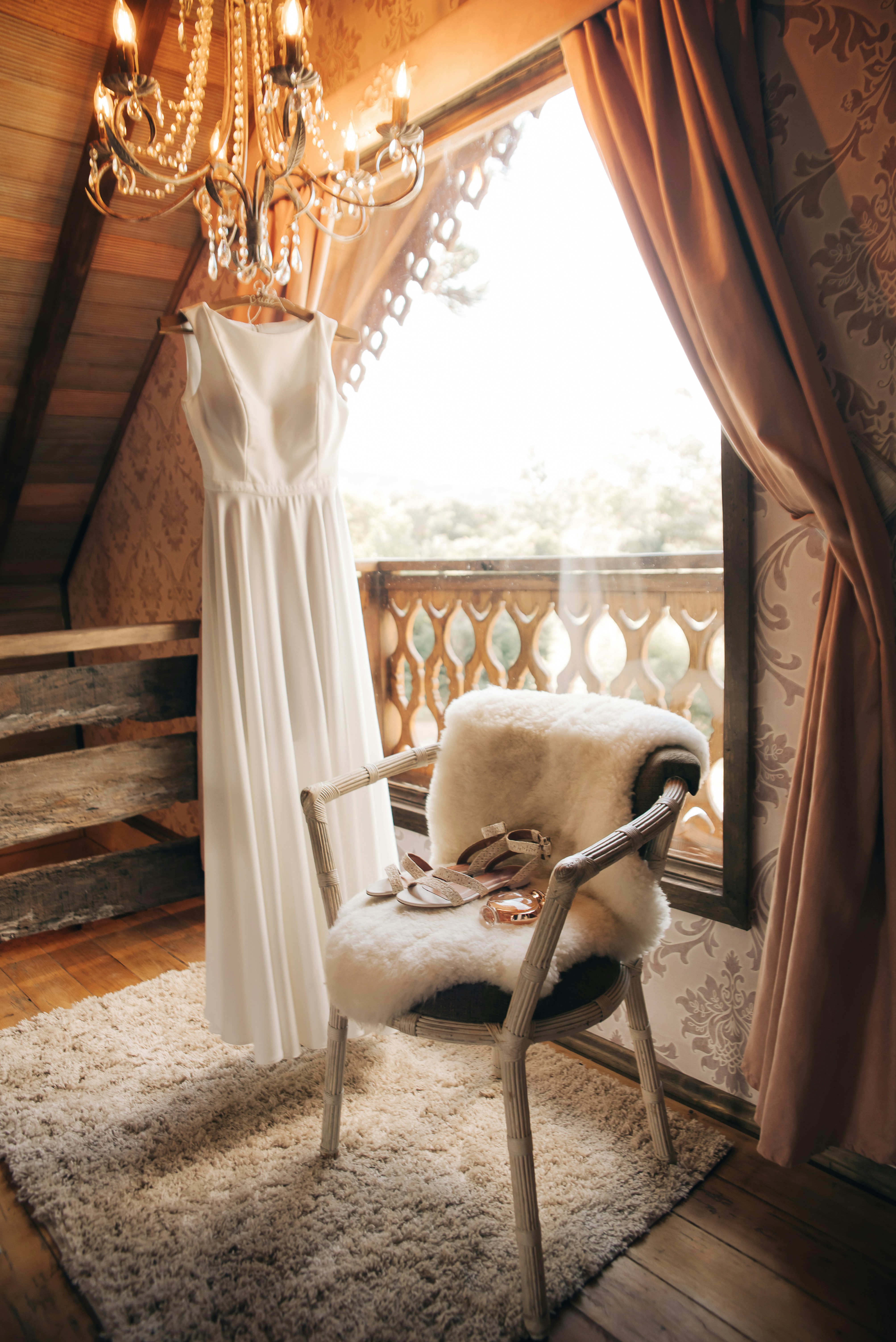 Silence in Satin: A Bridal Dress Framed by Warm Attic Light