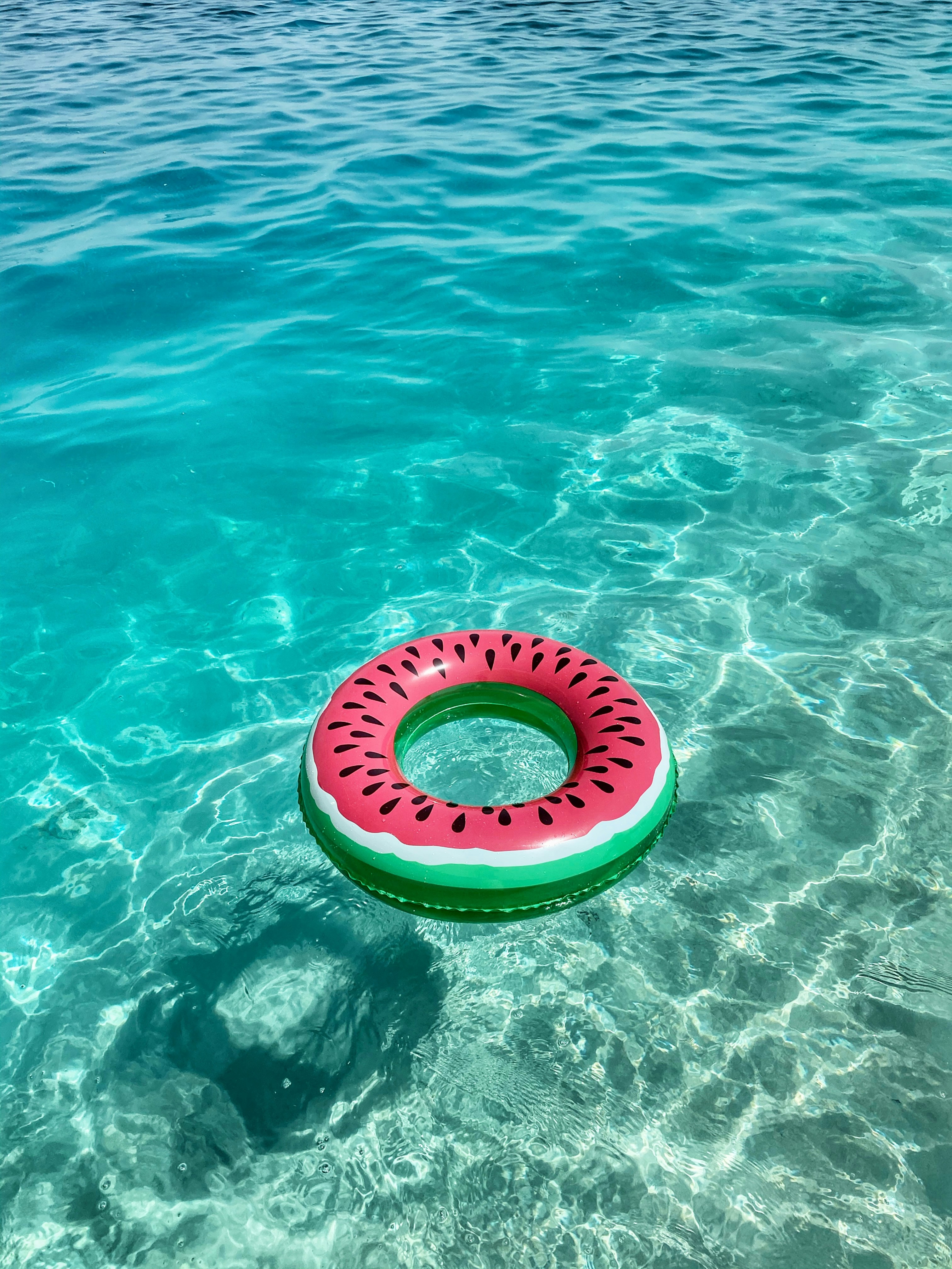 Watermelon Ring Adrift on Sunlit Turquoise Seas