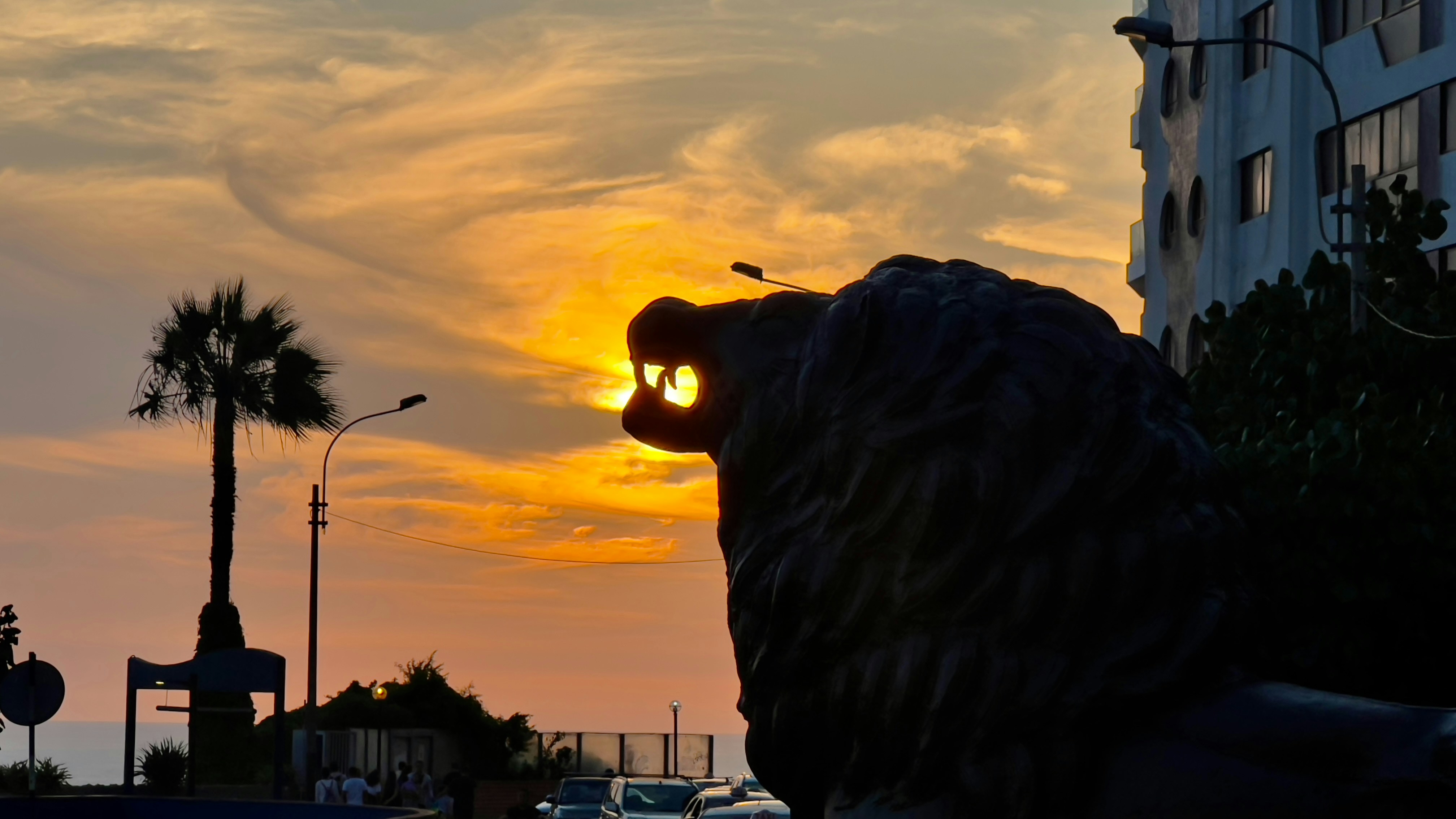 Golden Hour Roar: Jaguar Silhouette Against a Sunset Cityscape