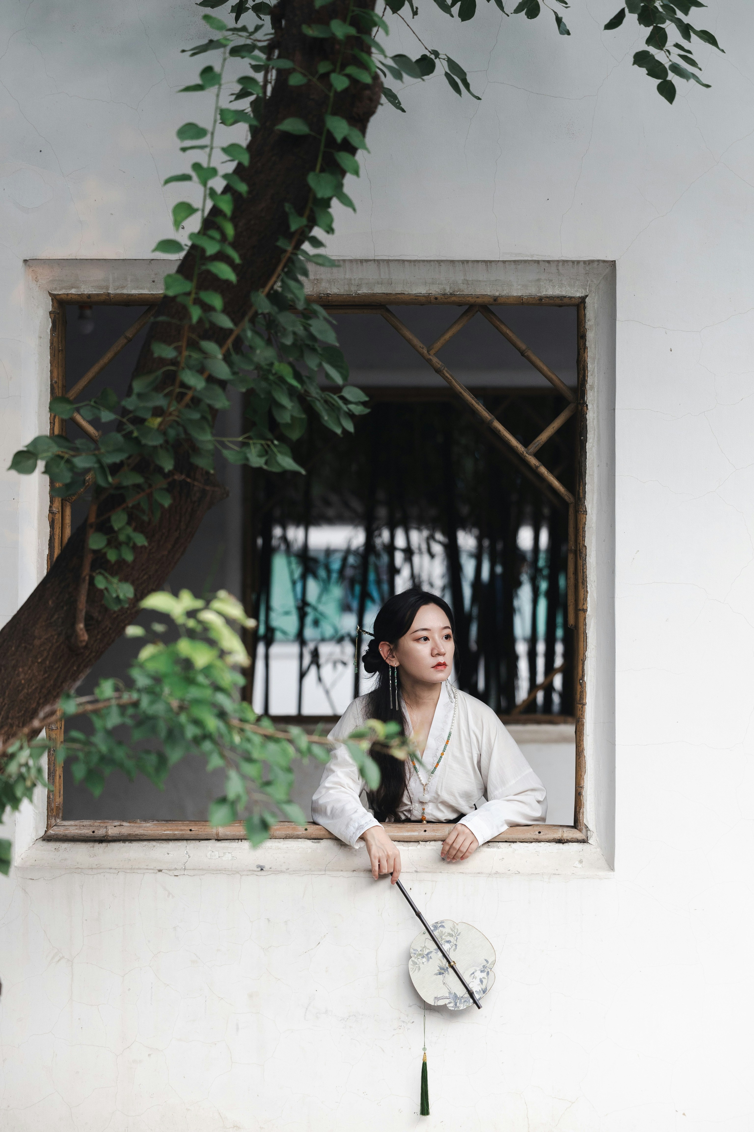 Ancient girl looked out through the window