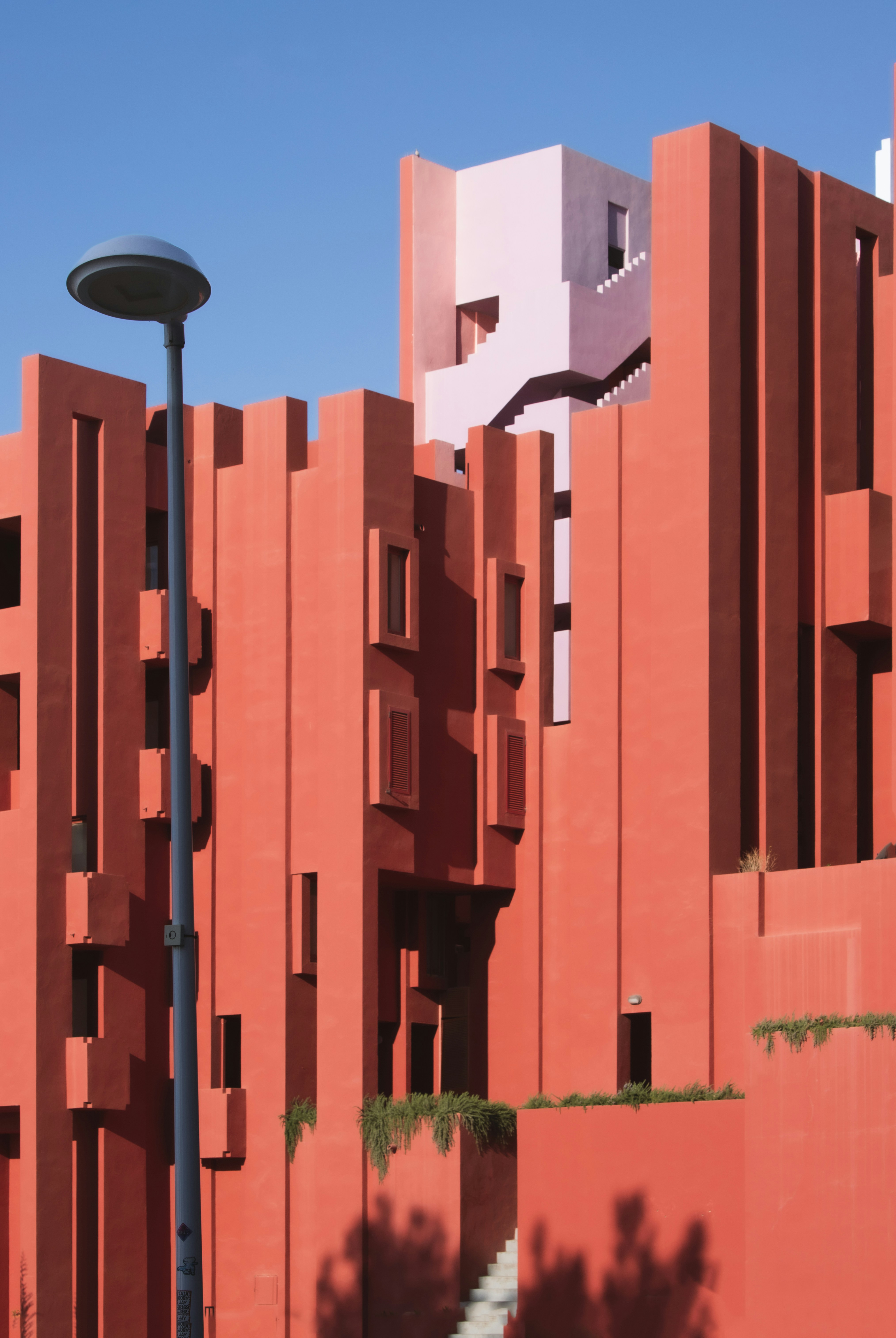 Crimson Towers Under a Blue Noon: A Graphic Urban Study