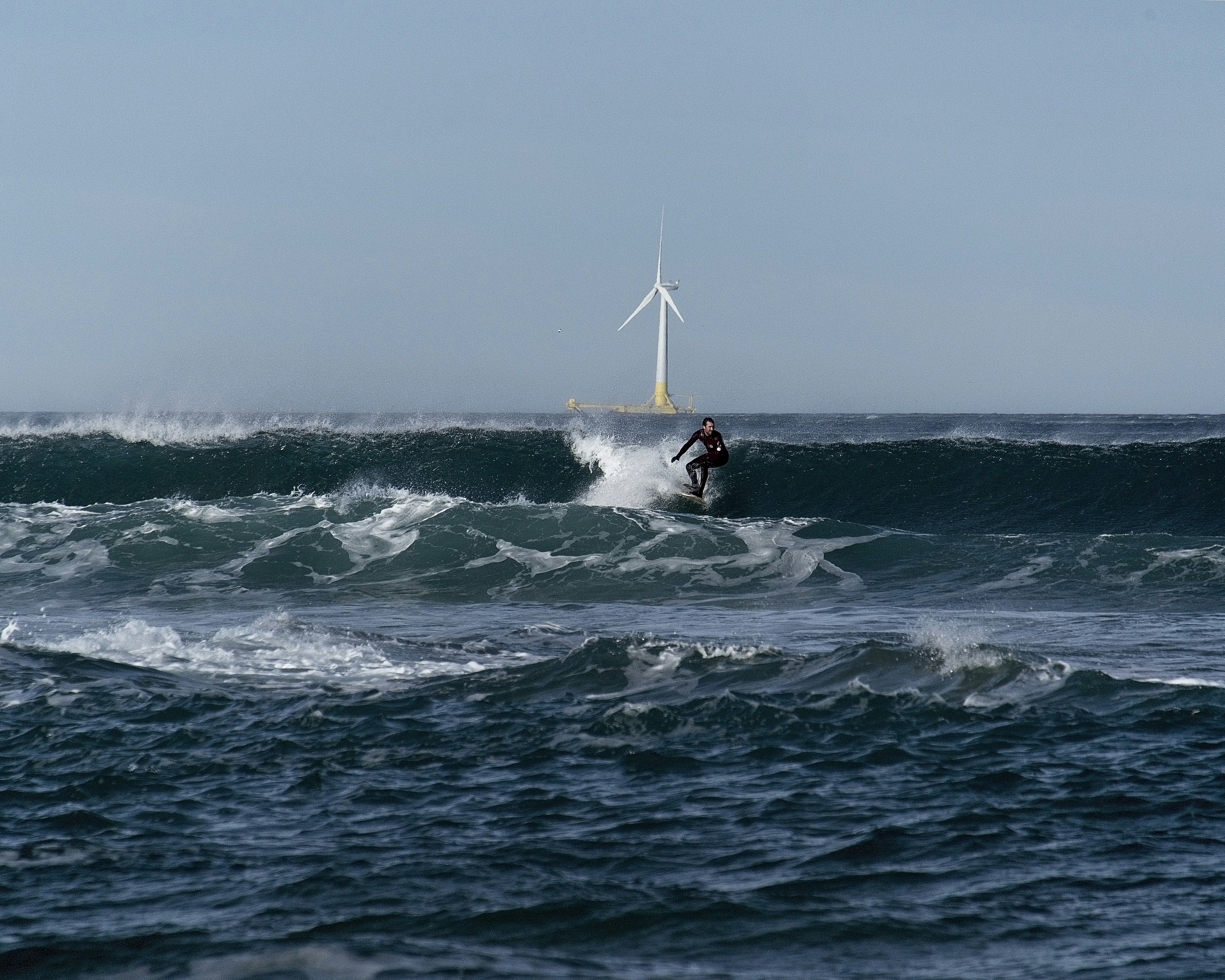 Wind Rider: Surfing the Crest with a Distant Turbine