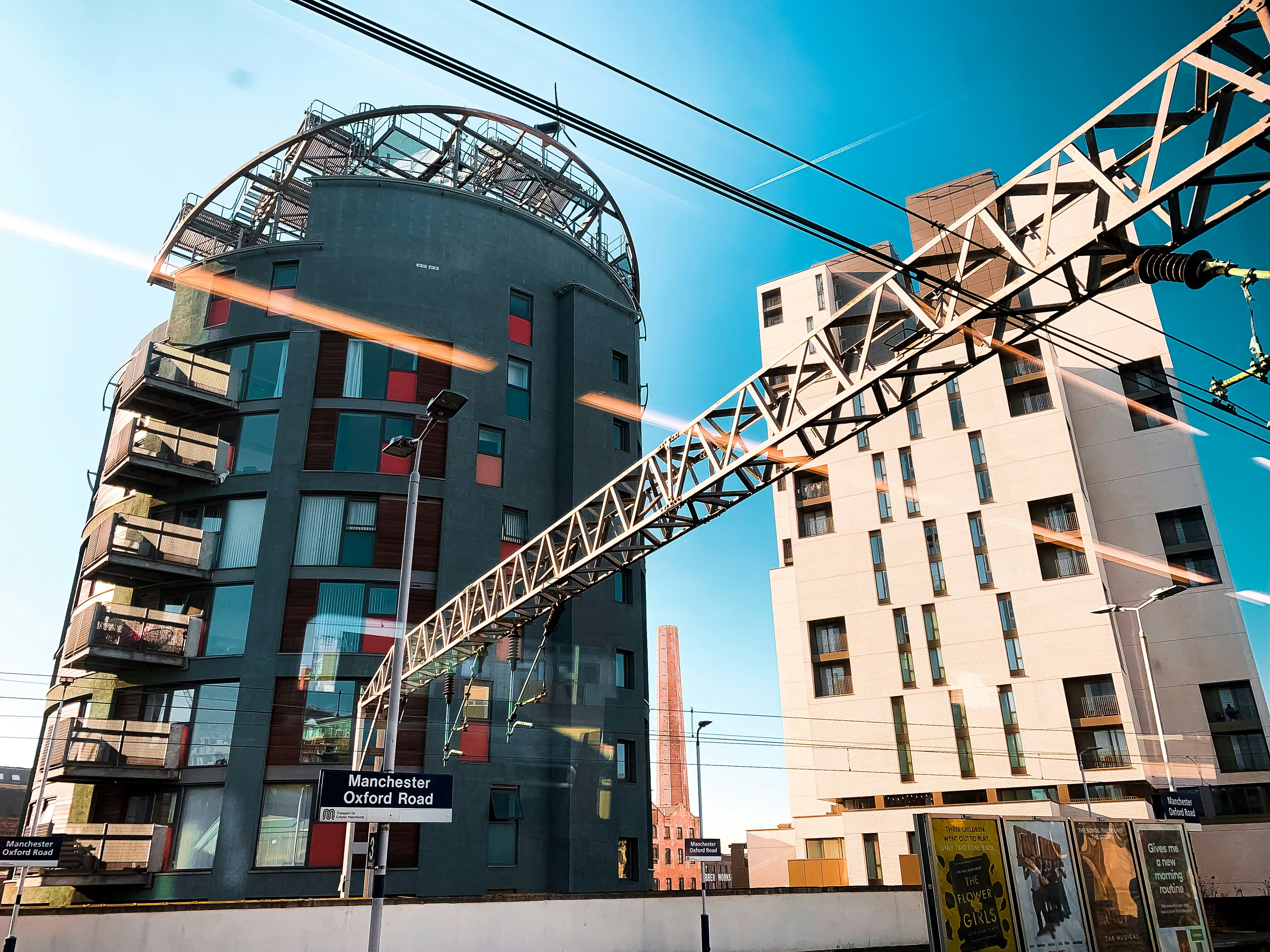 A tall building with a fire escape going up the side of it photo – Free ...