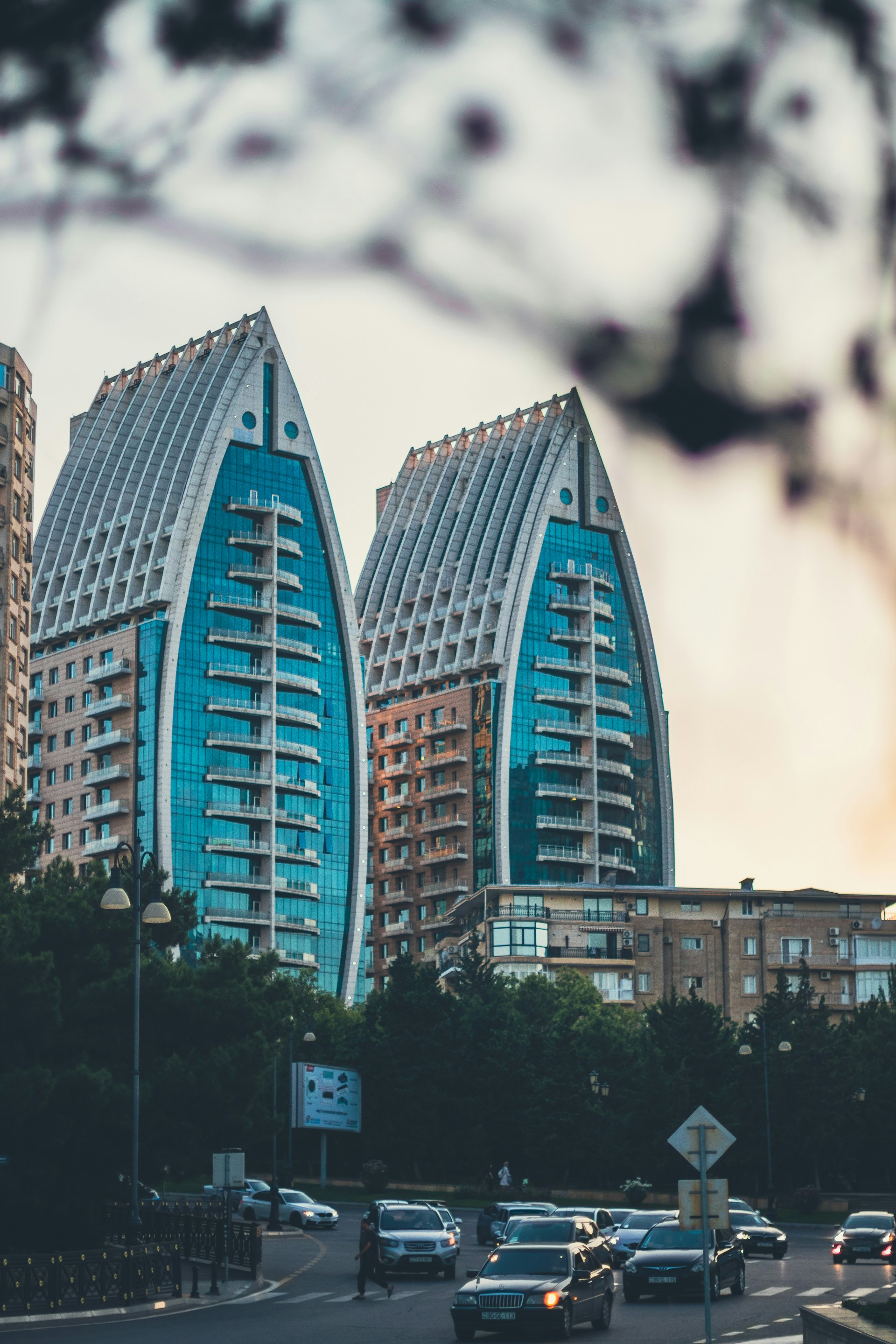 Twin Azure Towers Reaching Above the City Arc