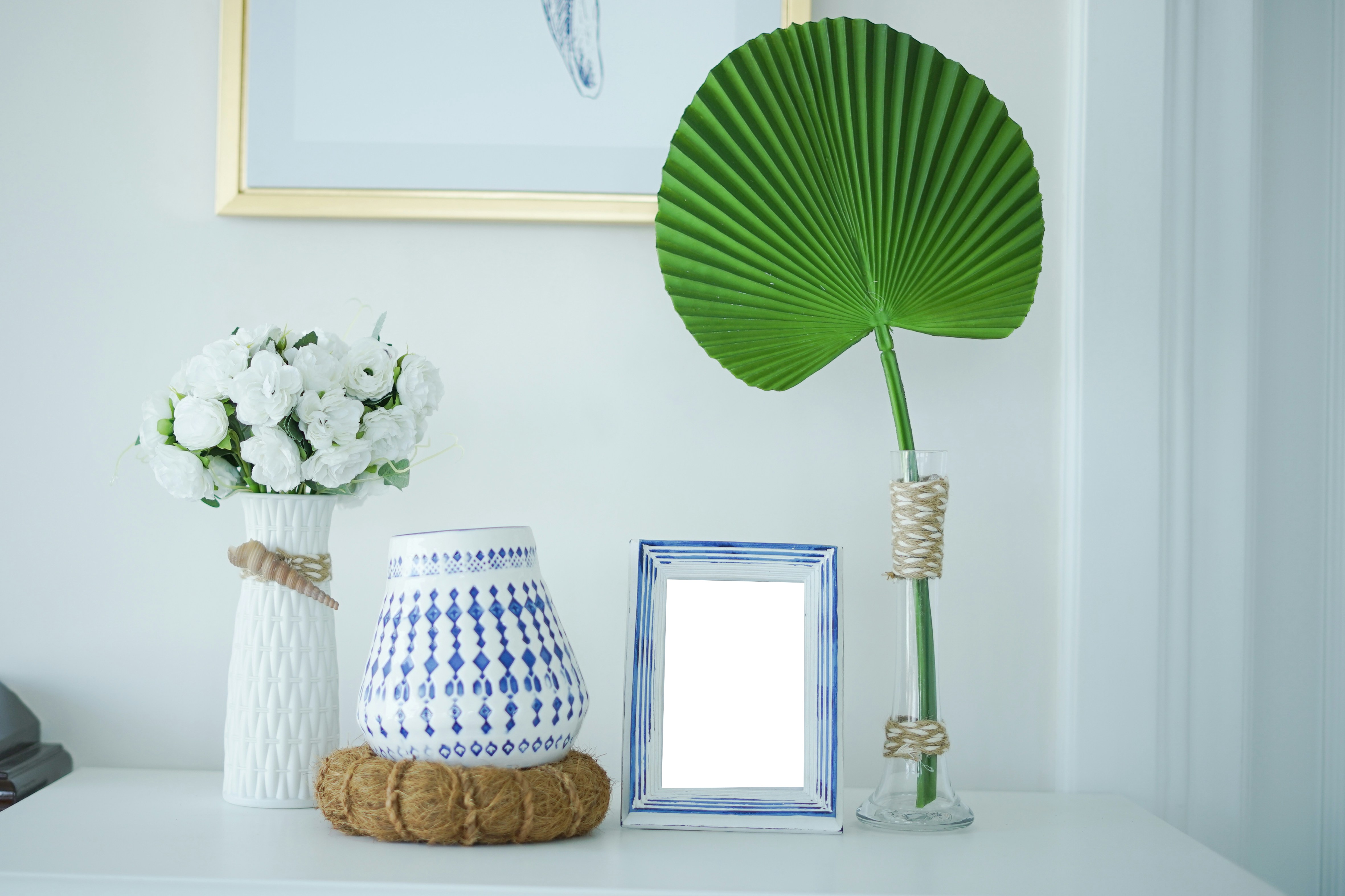 Green Palm as Quiet Centerpiece on a Minimalist White Shelf