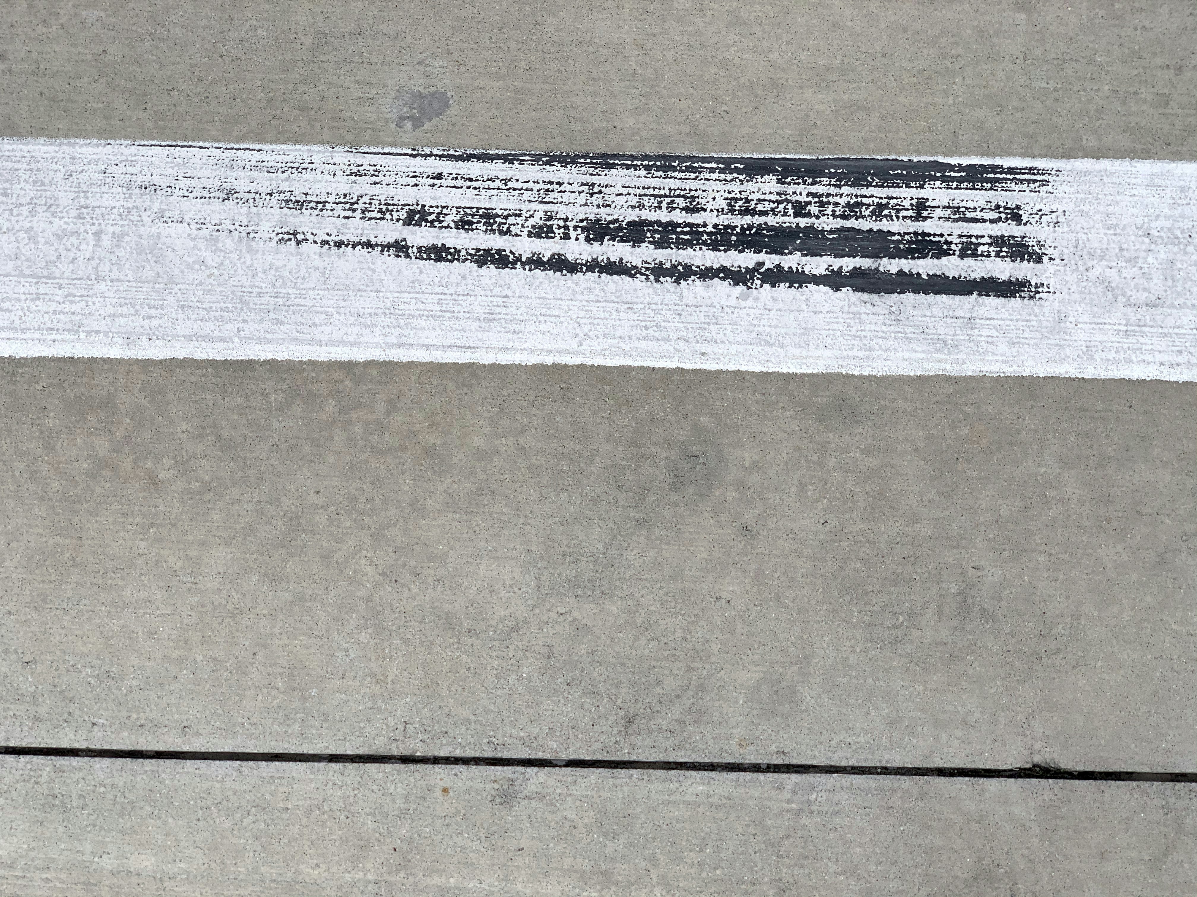 Tire mark on a white line