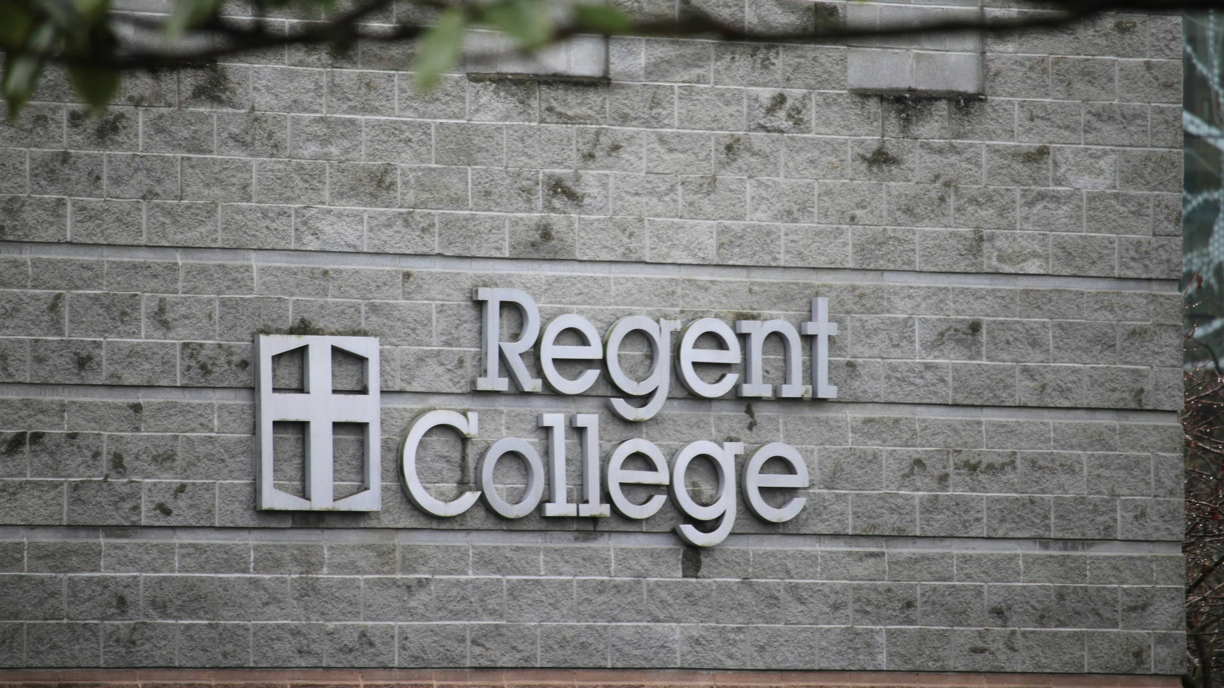 A sign on the side of a building that says regent college photo – Free ...
