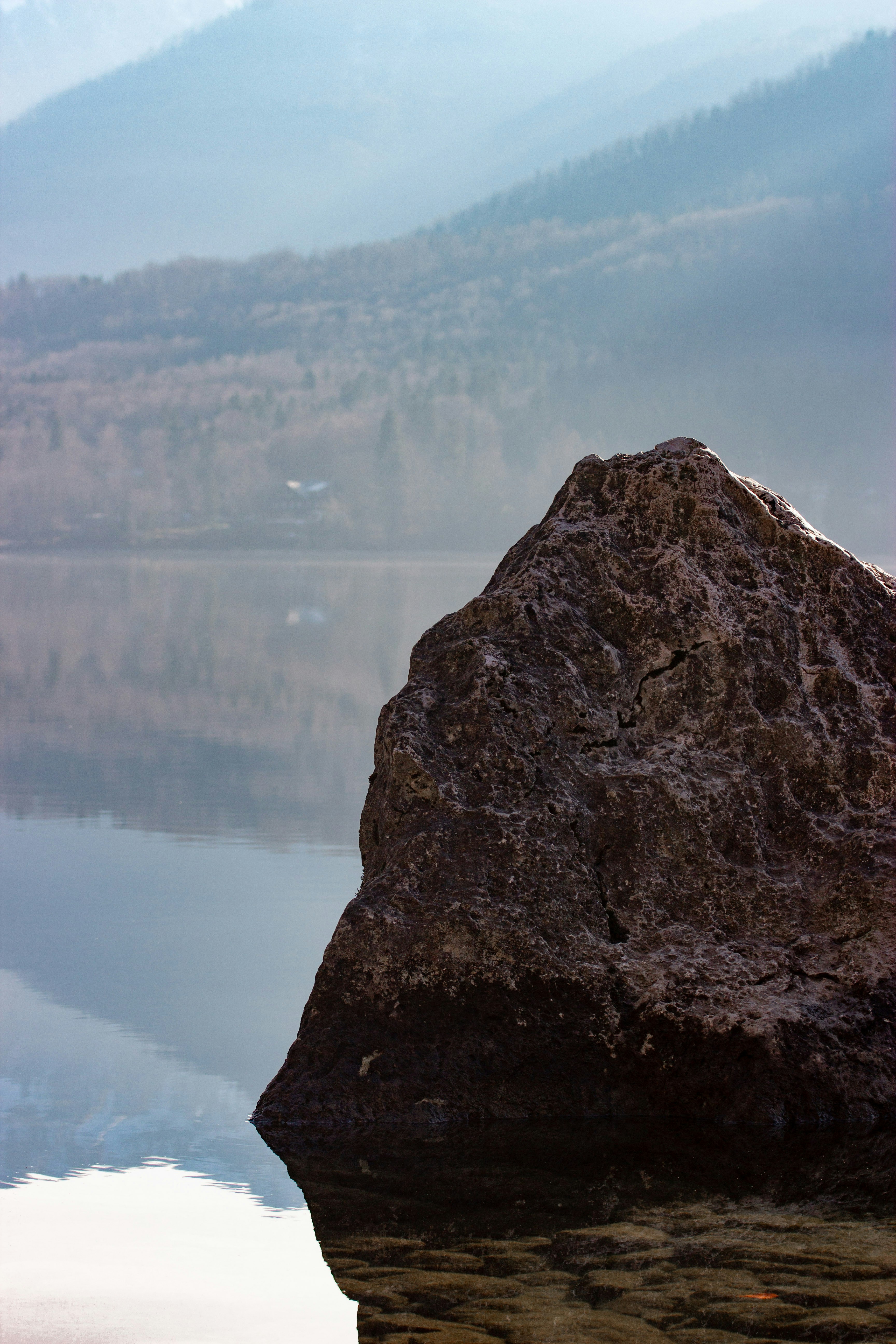 Granite Sentinel by a Misty Alpine Lake