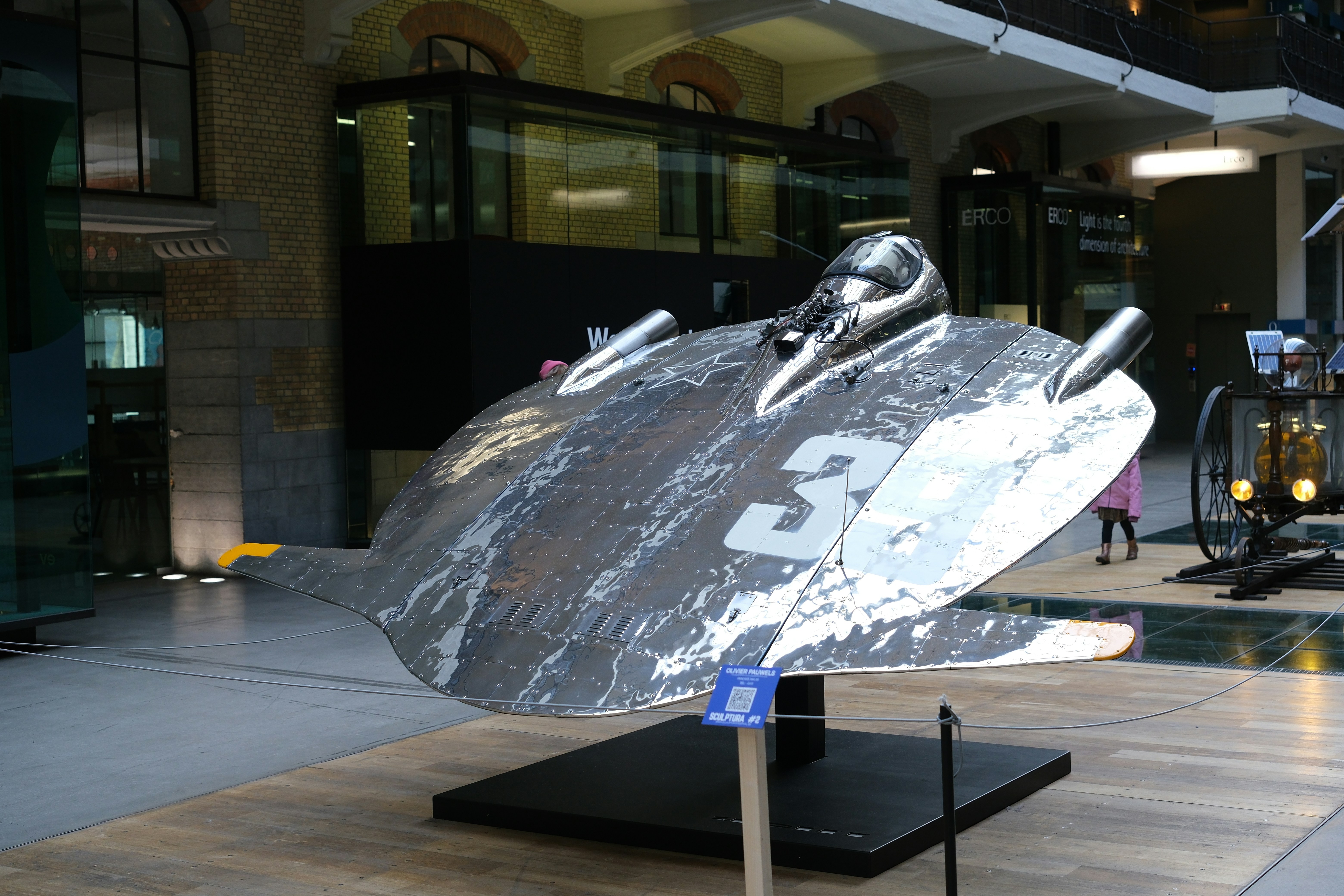 Silent Voyager: A Weathered Spacecraft Surfaces in Gallery Light