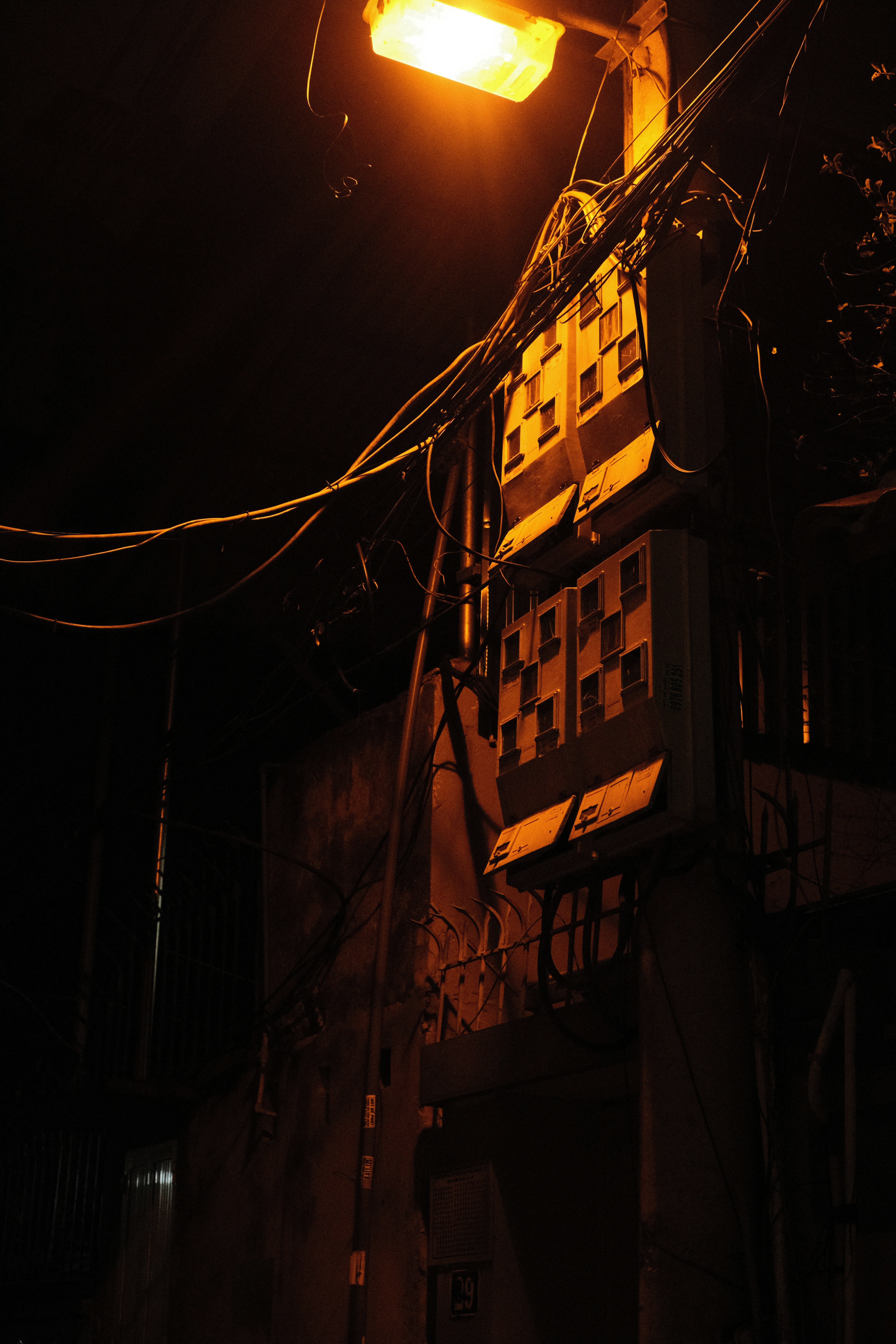 Neon Currents in a Narrow Alley: Meters and Wires Under Warm Glow