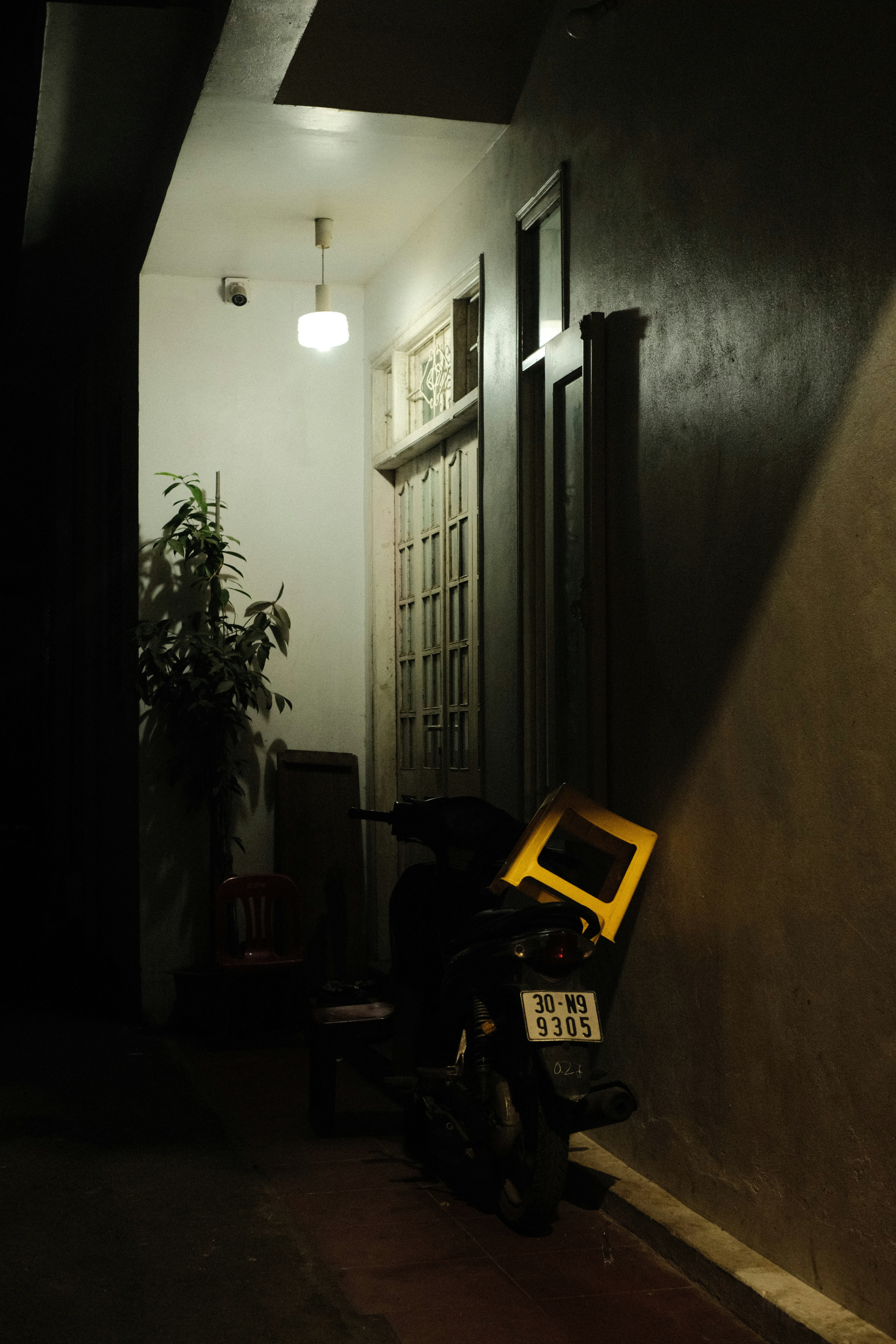 Yellow Frame at the Corridor's Edge: A Quiet Night Motorcycle Scene
