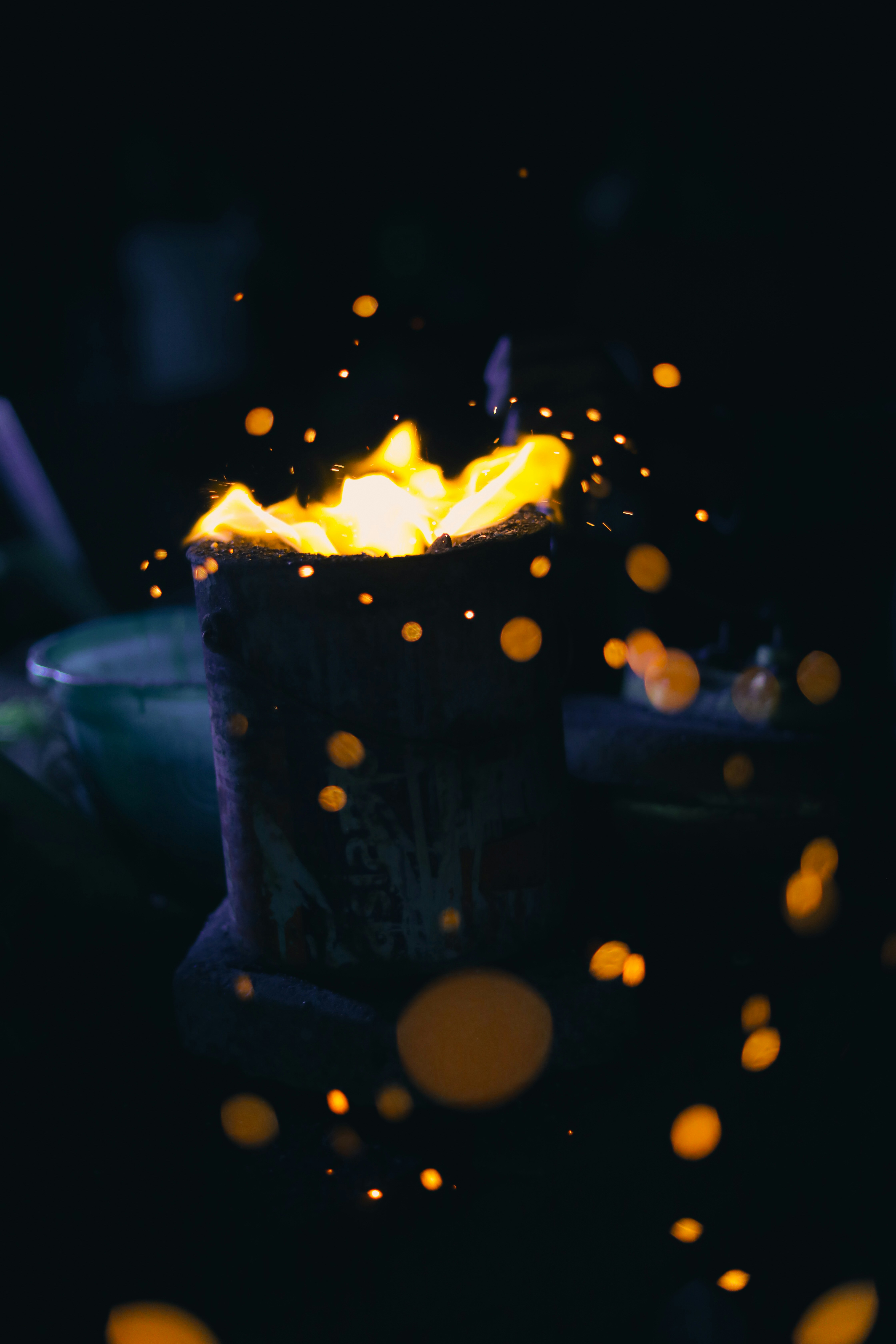A fire is lit up in the dark photo – Free Wallpaper Image on Unsplash