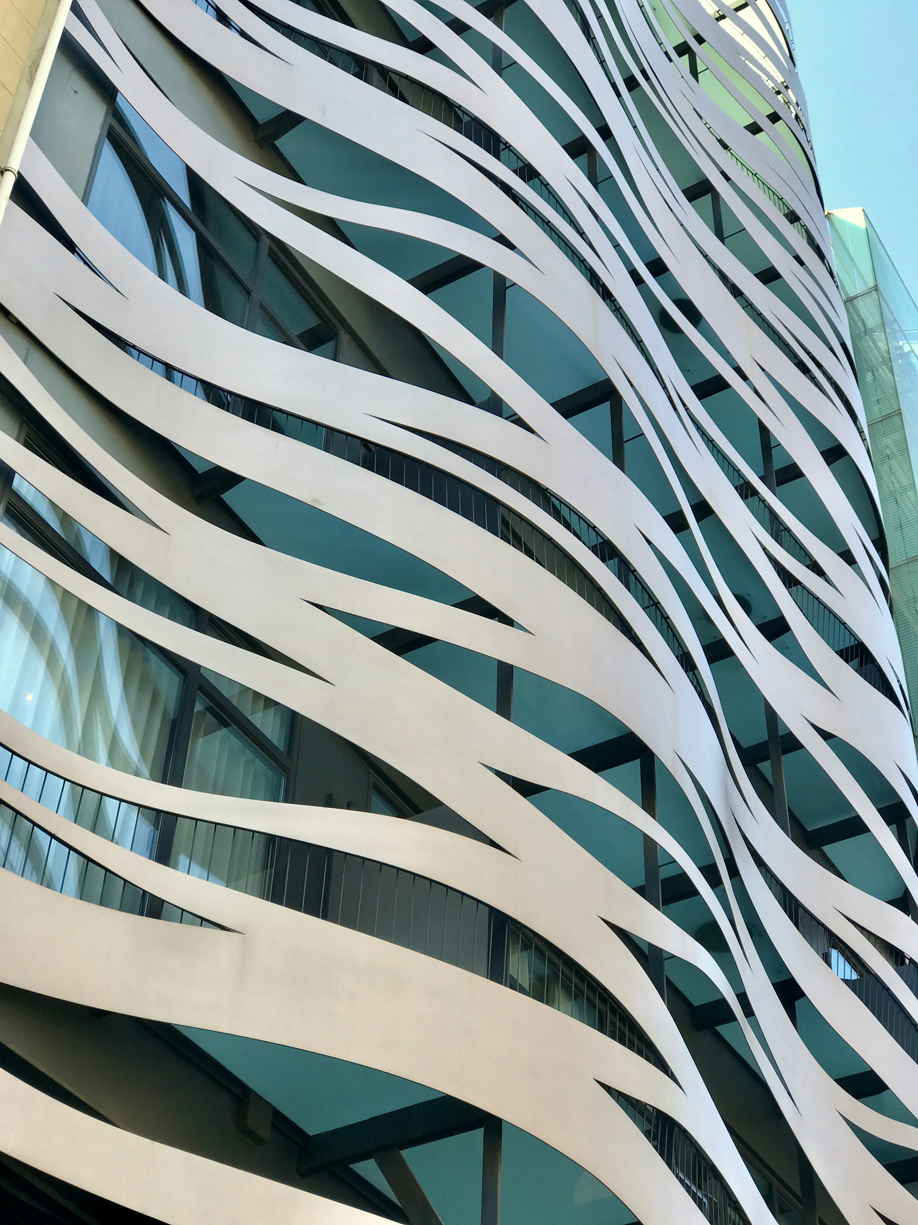 Ribbons of Light: The Wave-Folded Facade of a Glass Building