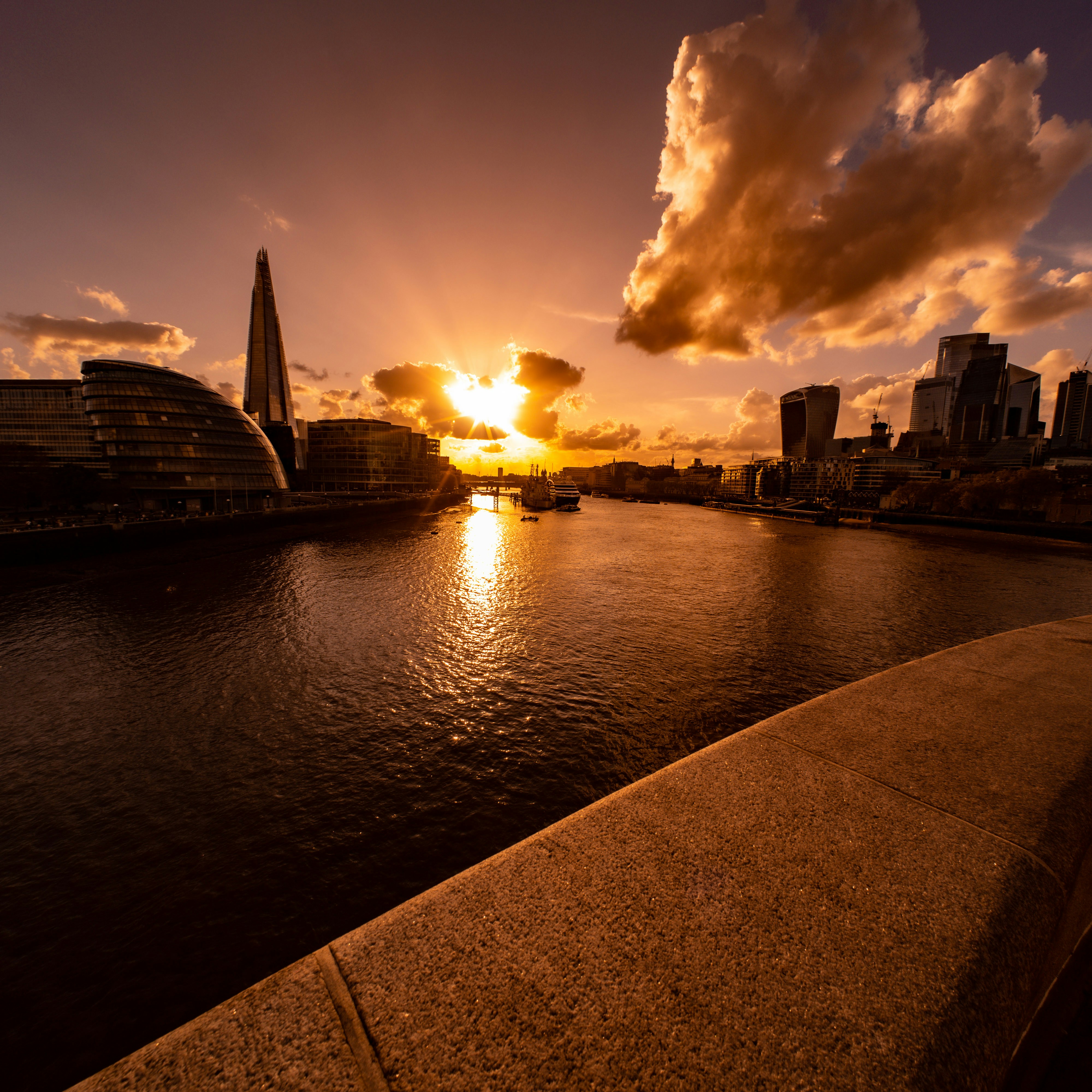 Sunburst Over the Thames: Golden Hour Between Riverside Curves and Glass Towers