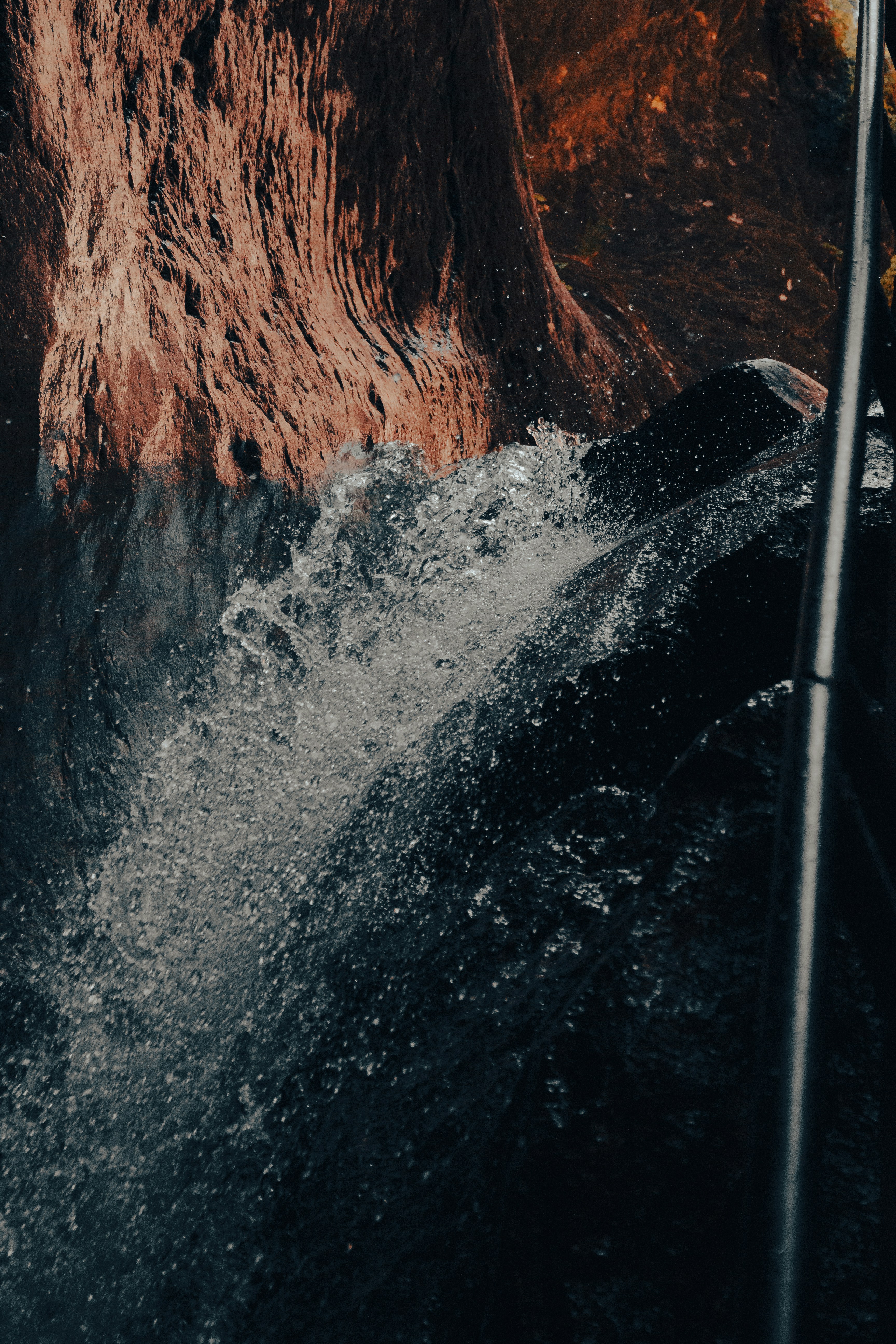 Rushing Tide Against Tidal Rock Face