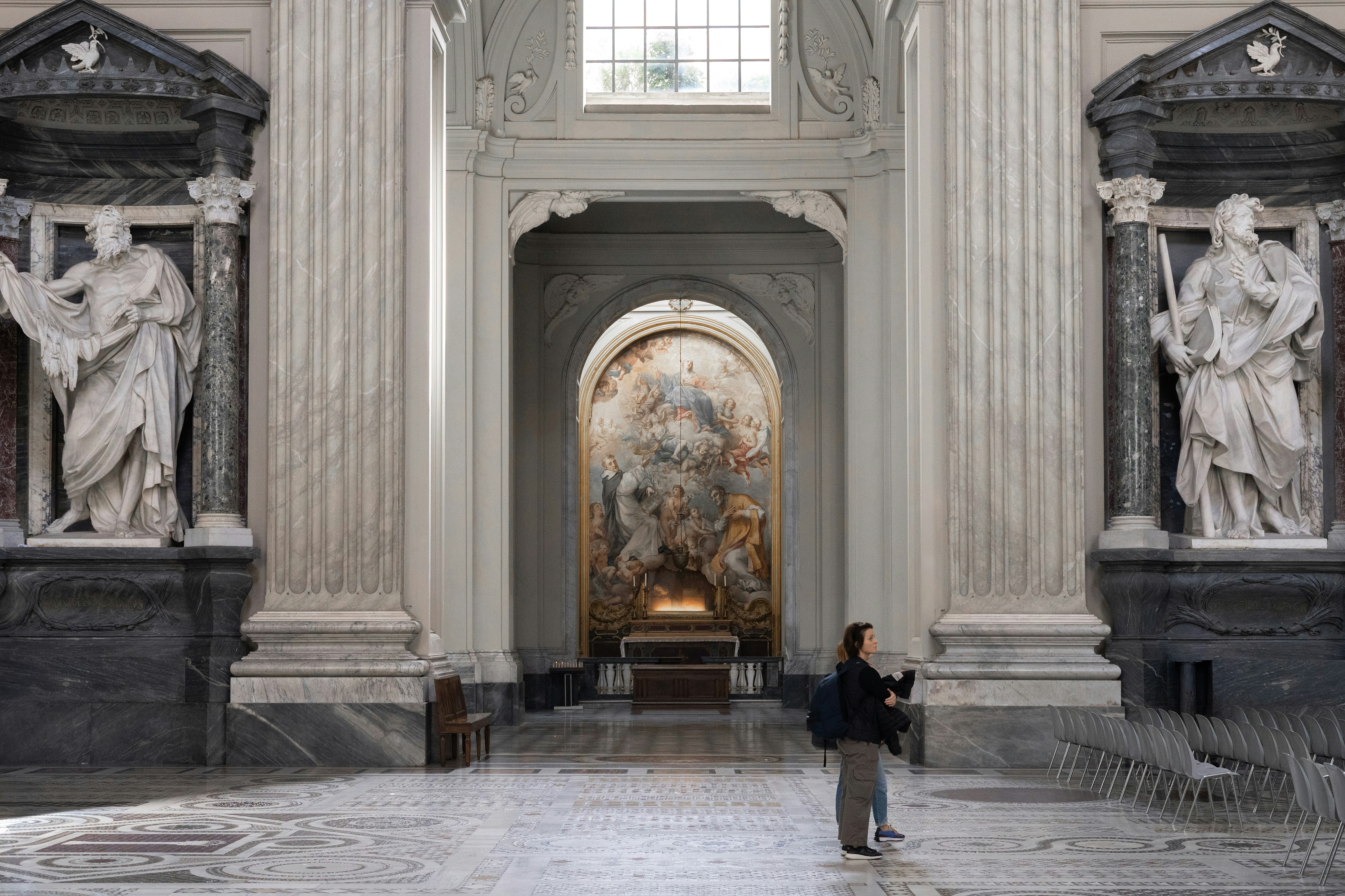 A woman standing in a large room with statues photo – Free West europe ...