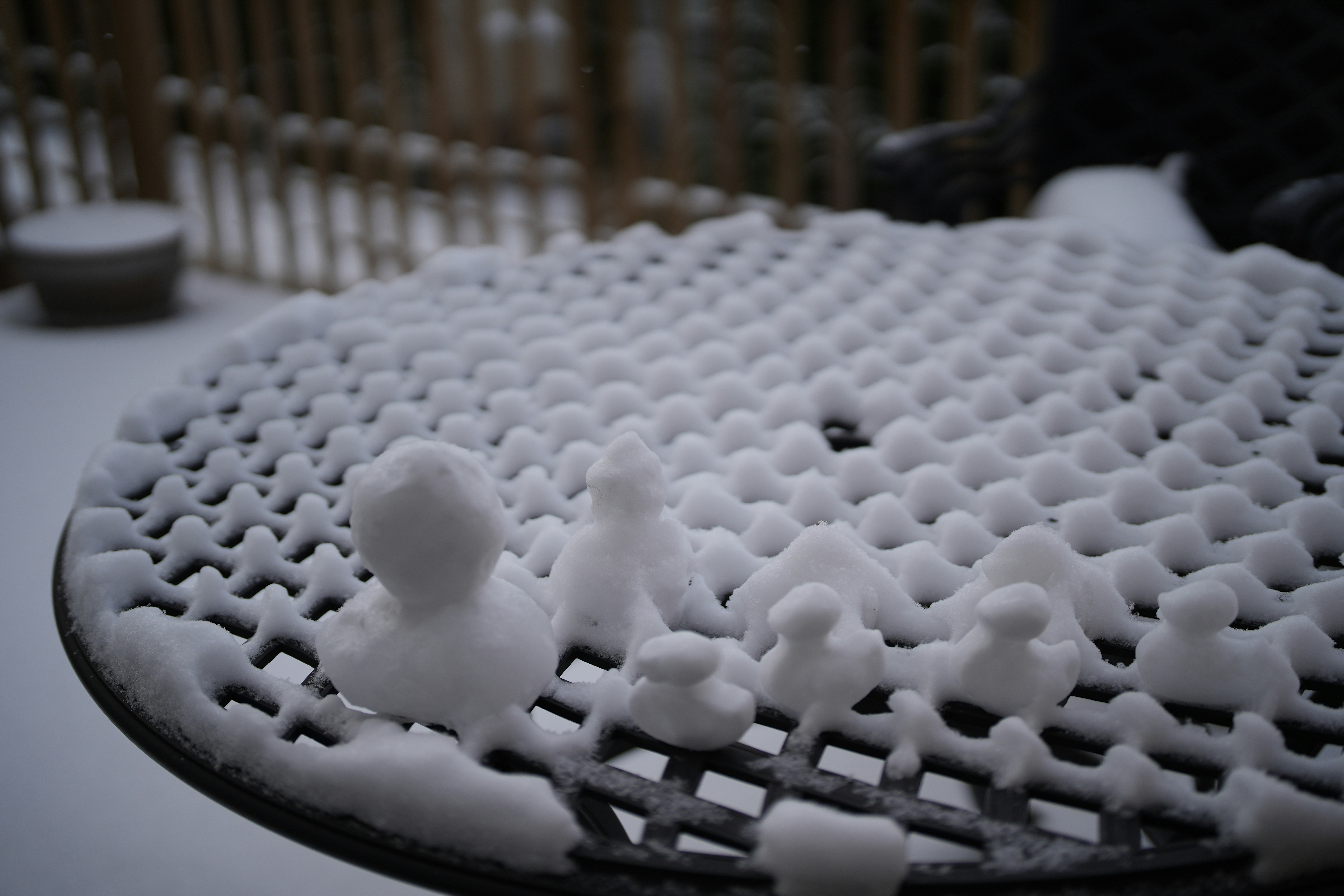 Mini Snow Figures on a Frosted Lattice Table