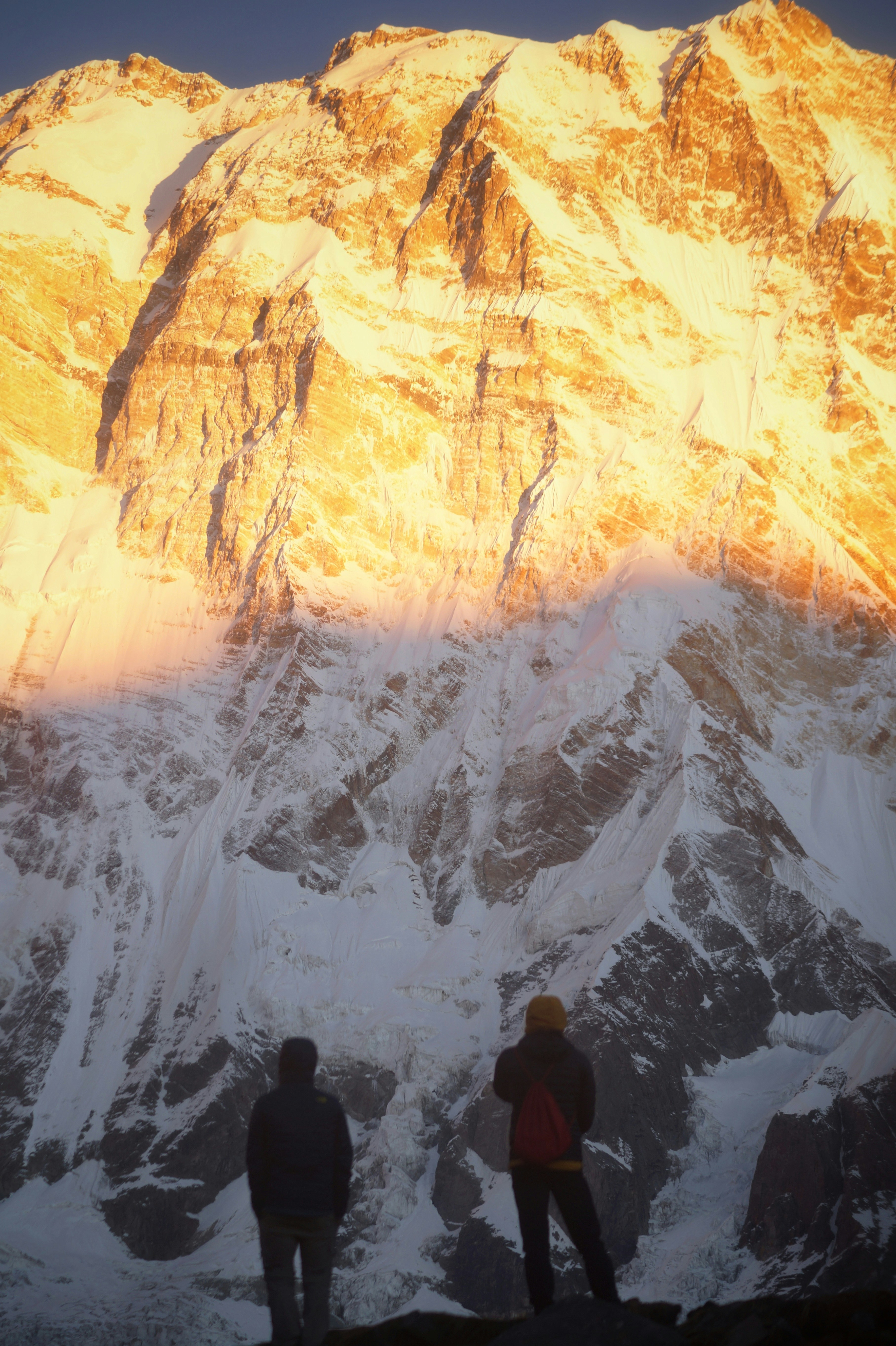 Alpenglow Summit: Two Climbers at the Edge of a Golden Ridge