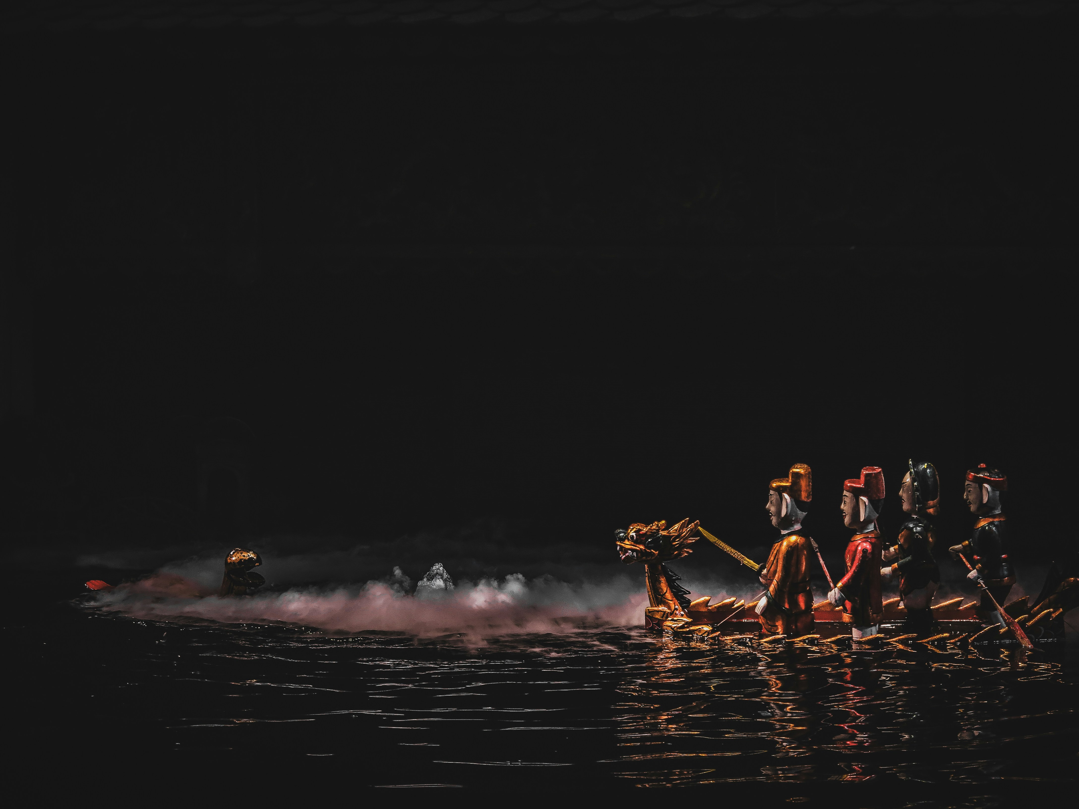 a group of people riding on the back of a boat