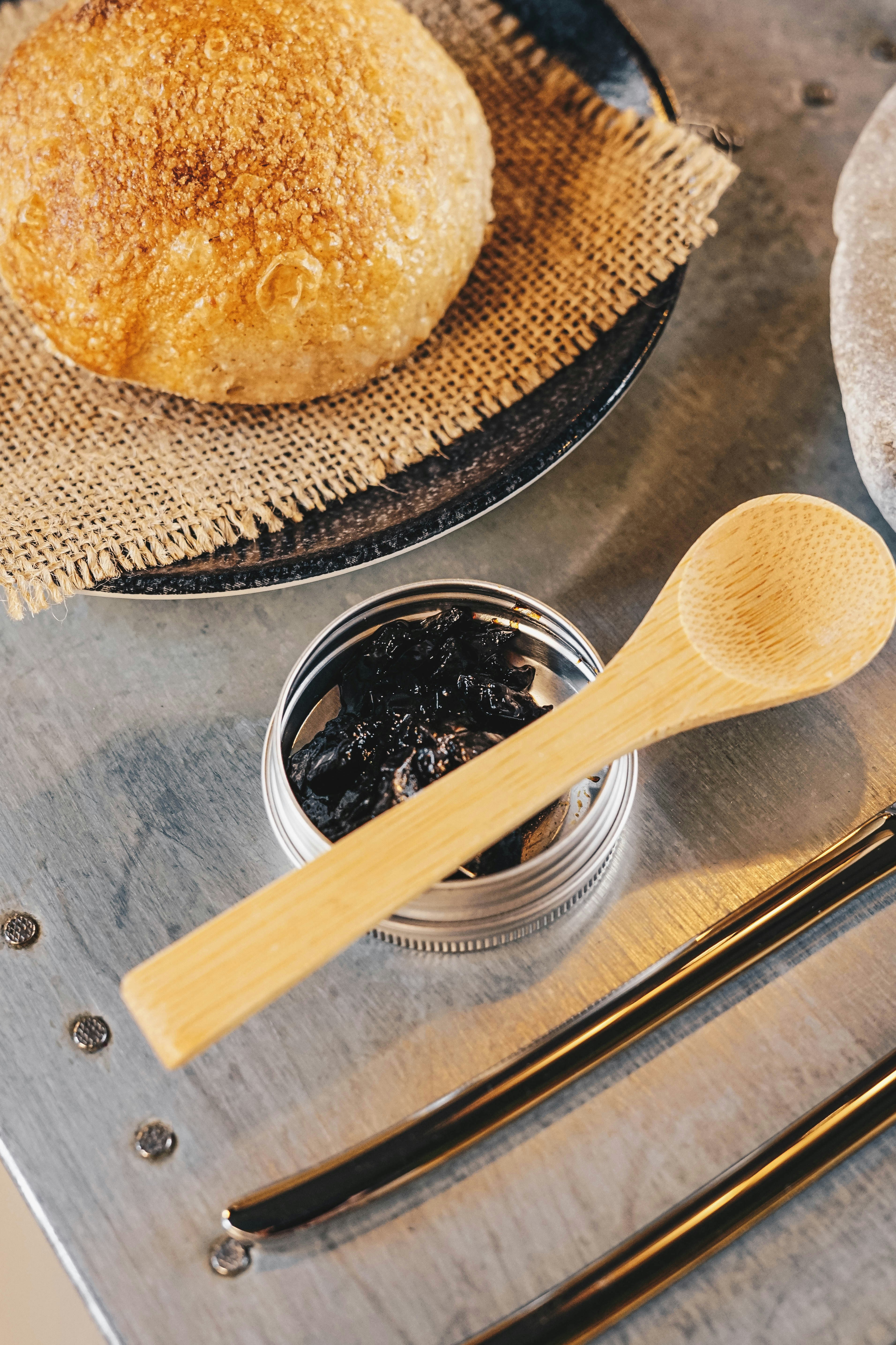 Golden Bun, Dark Tins, and a Wooden Scoop: An At-Home Bakescape