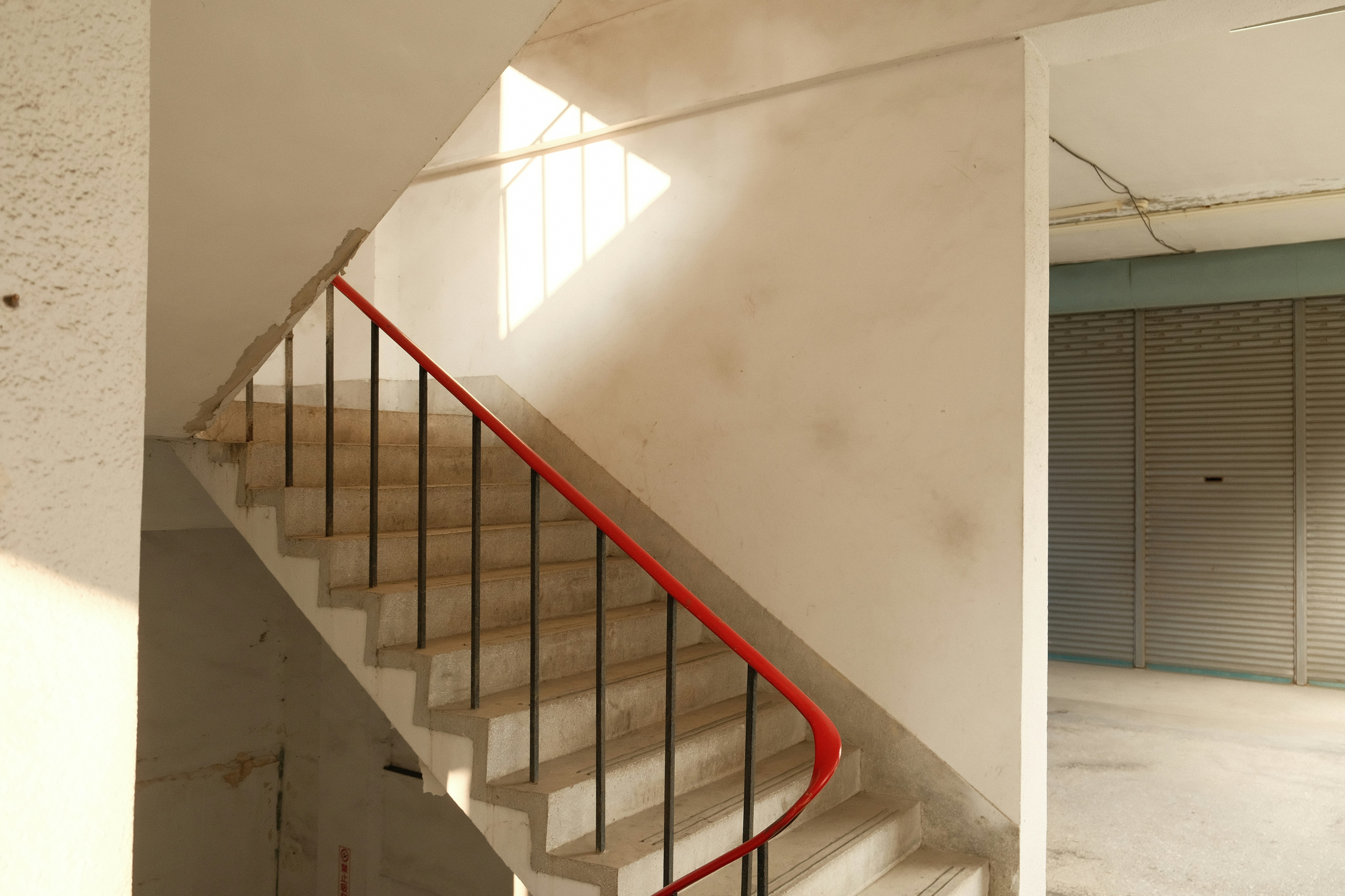 A white staircase with a red hand rail photo – Free Staircase Image on ...
