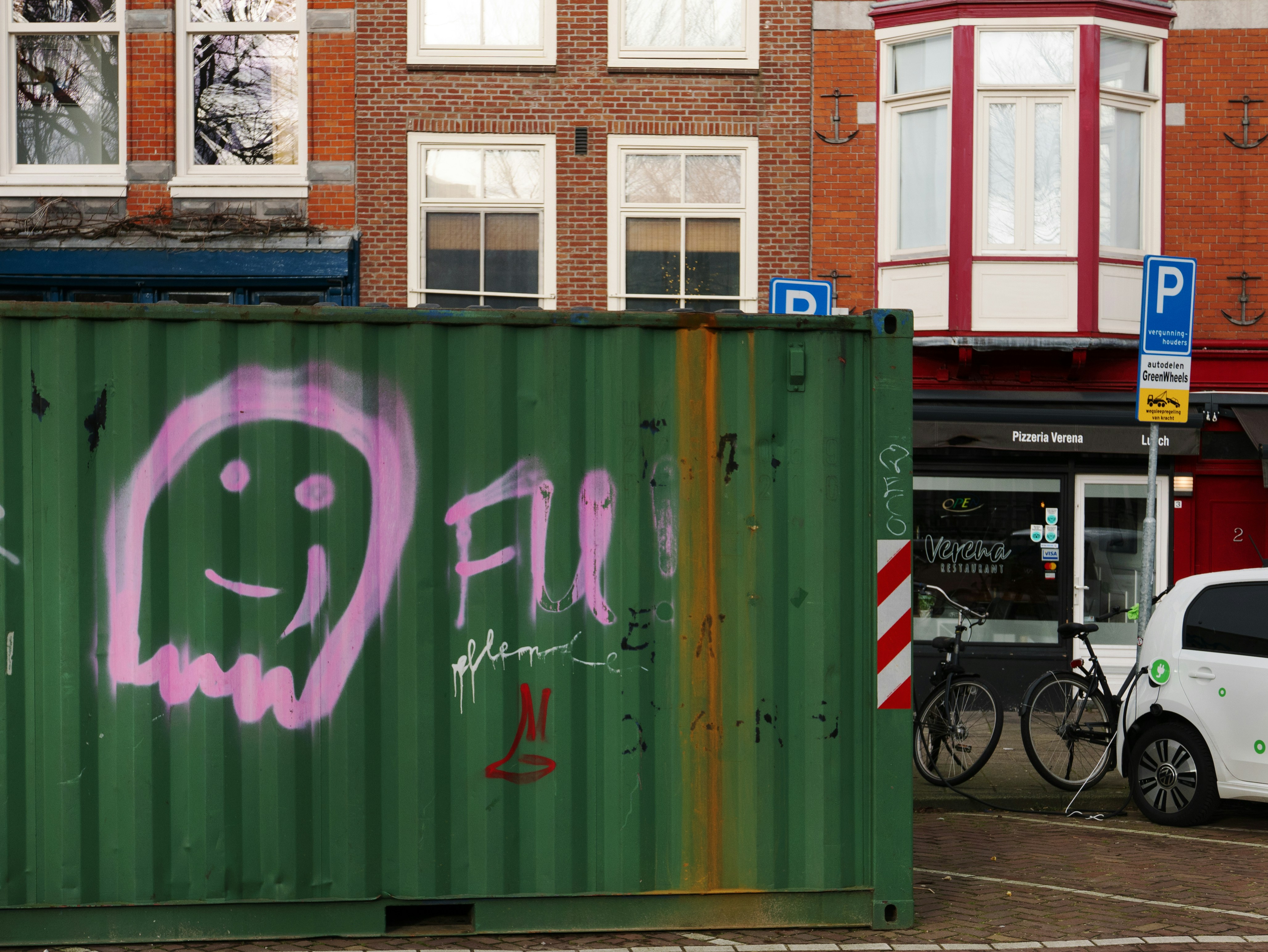 A green shipping container with graffiti on it photo – Free Amsterdam ...