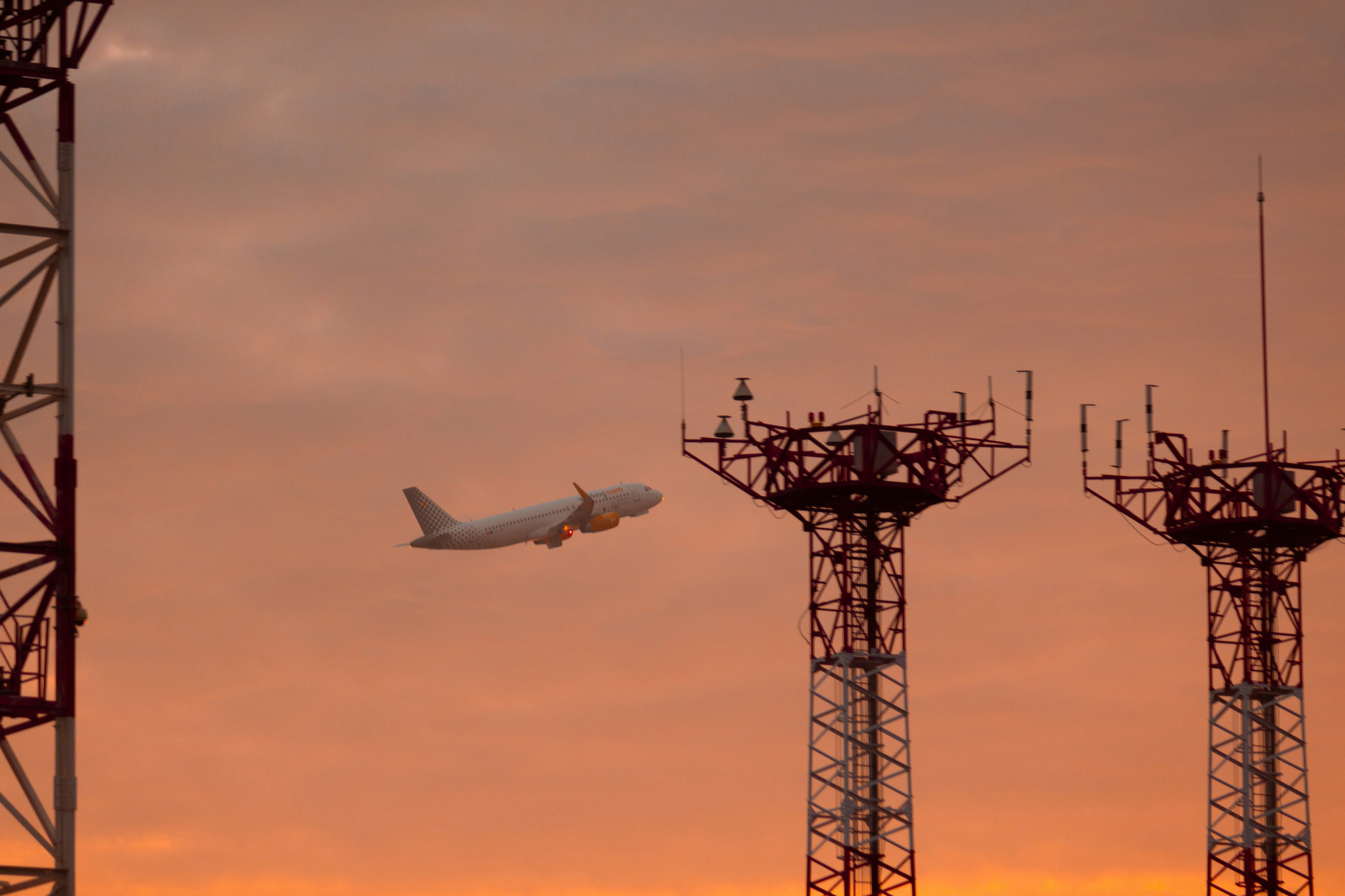 Between Towers and Ember Sky: A Sunset Takeoff