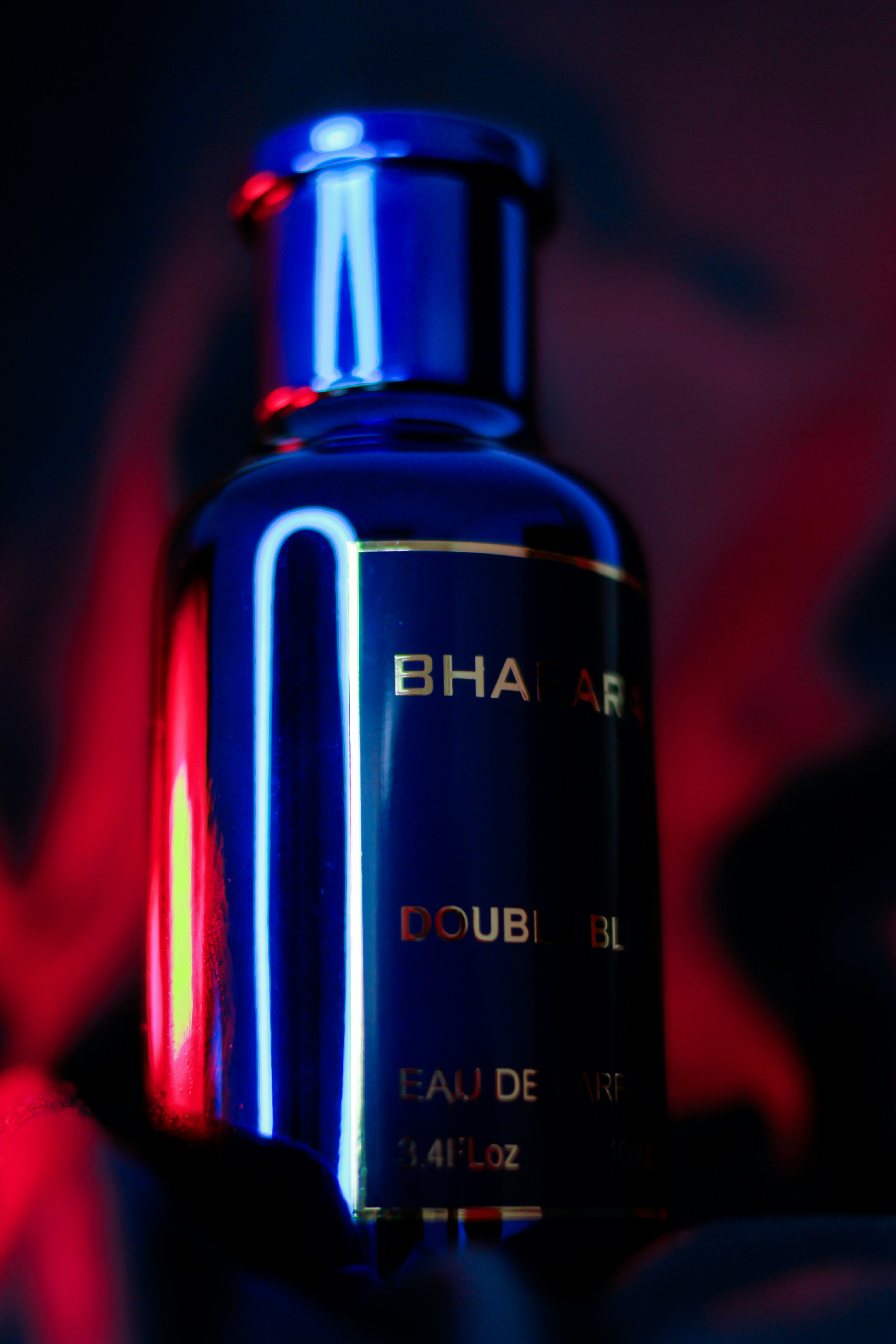 Indigo Neon: A Perfume Bottle Carved in Velvet Red Light