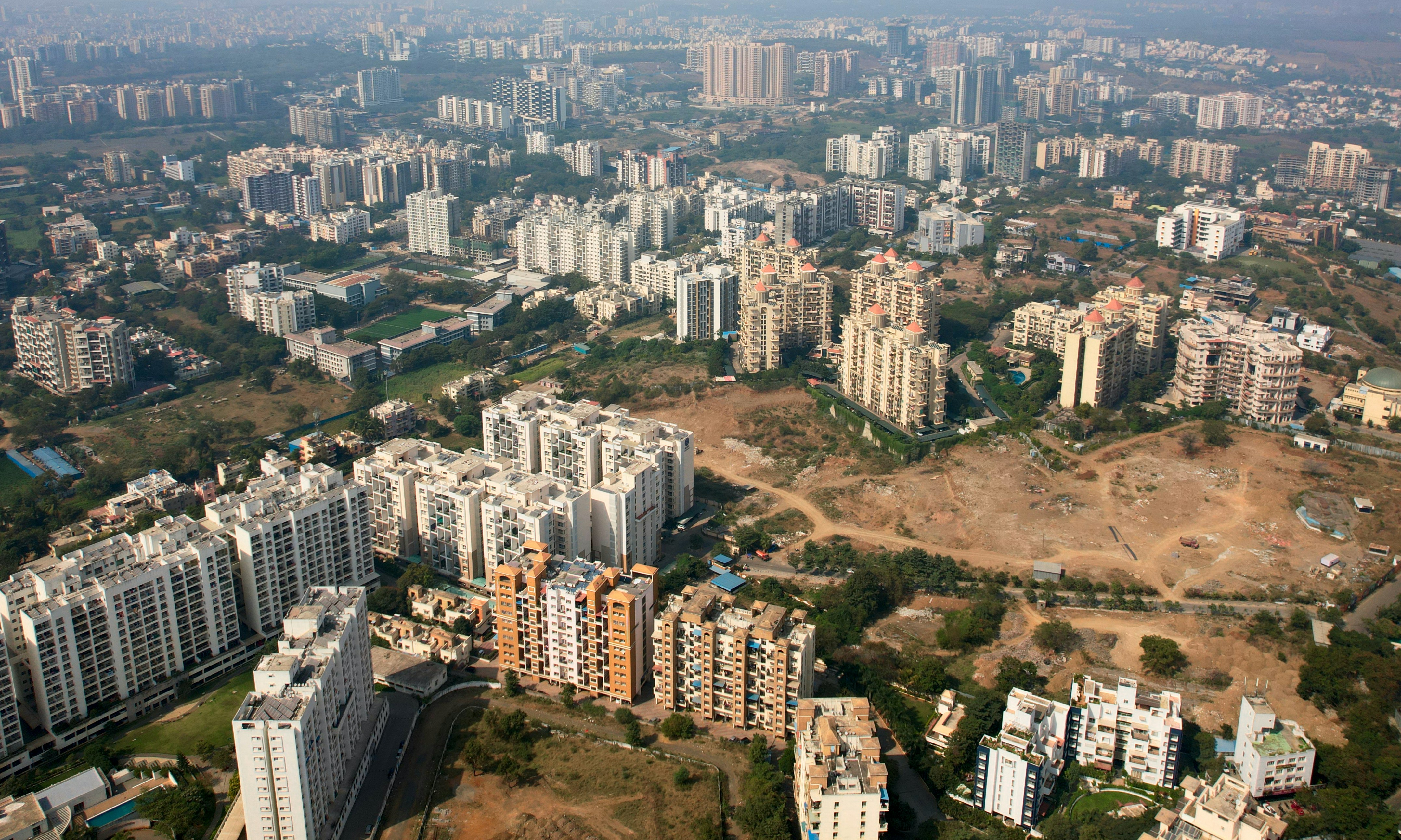 Aerial view of Undri's diverse skyline featuring high-rise buildings and patches of greenery.