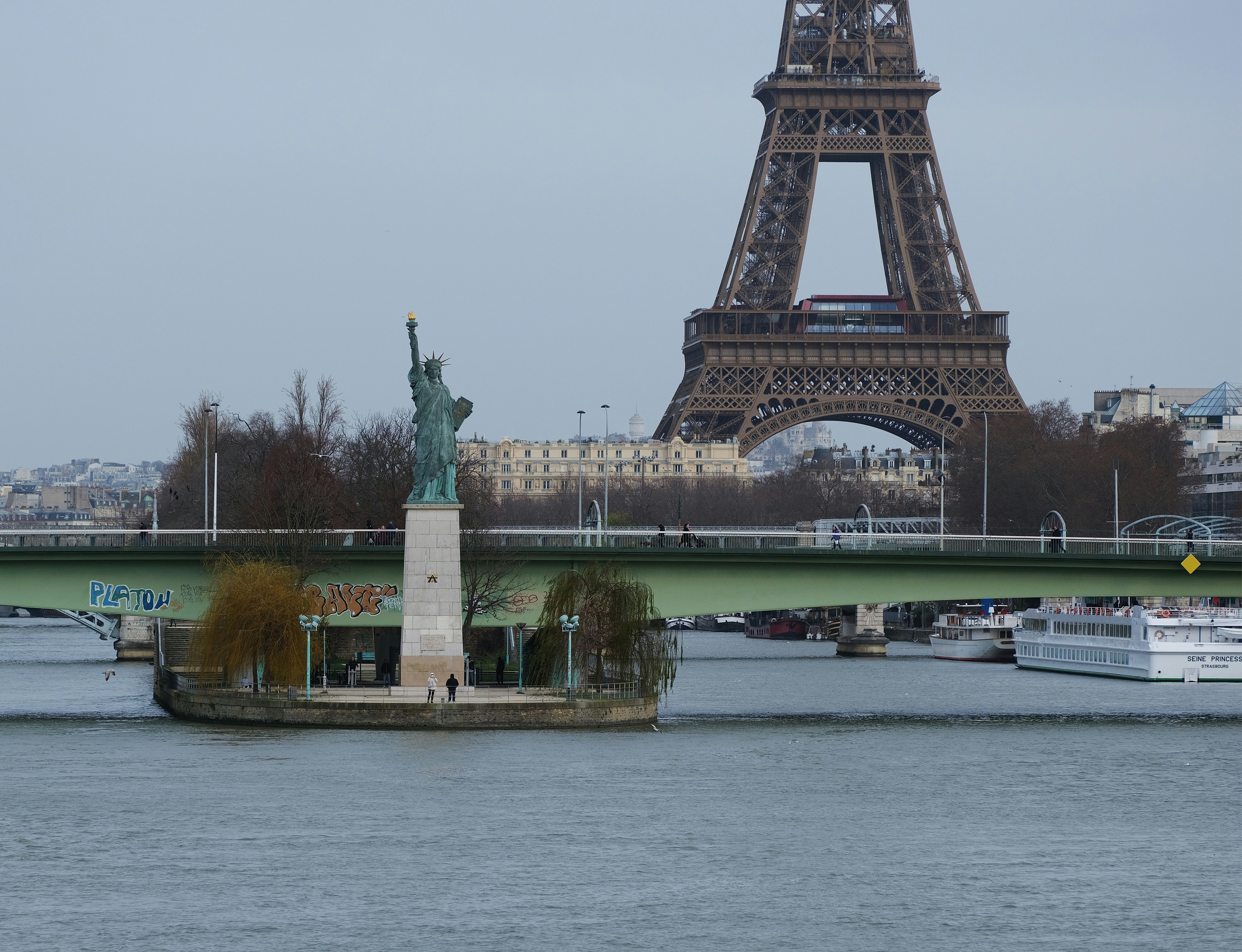 Parisian Confluence: Eiffel Tower Framing a Quiet Seine Crossing