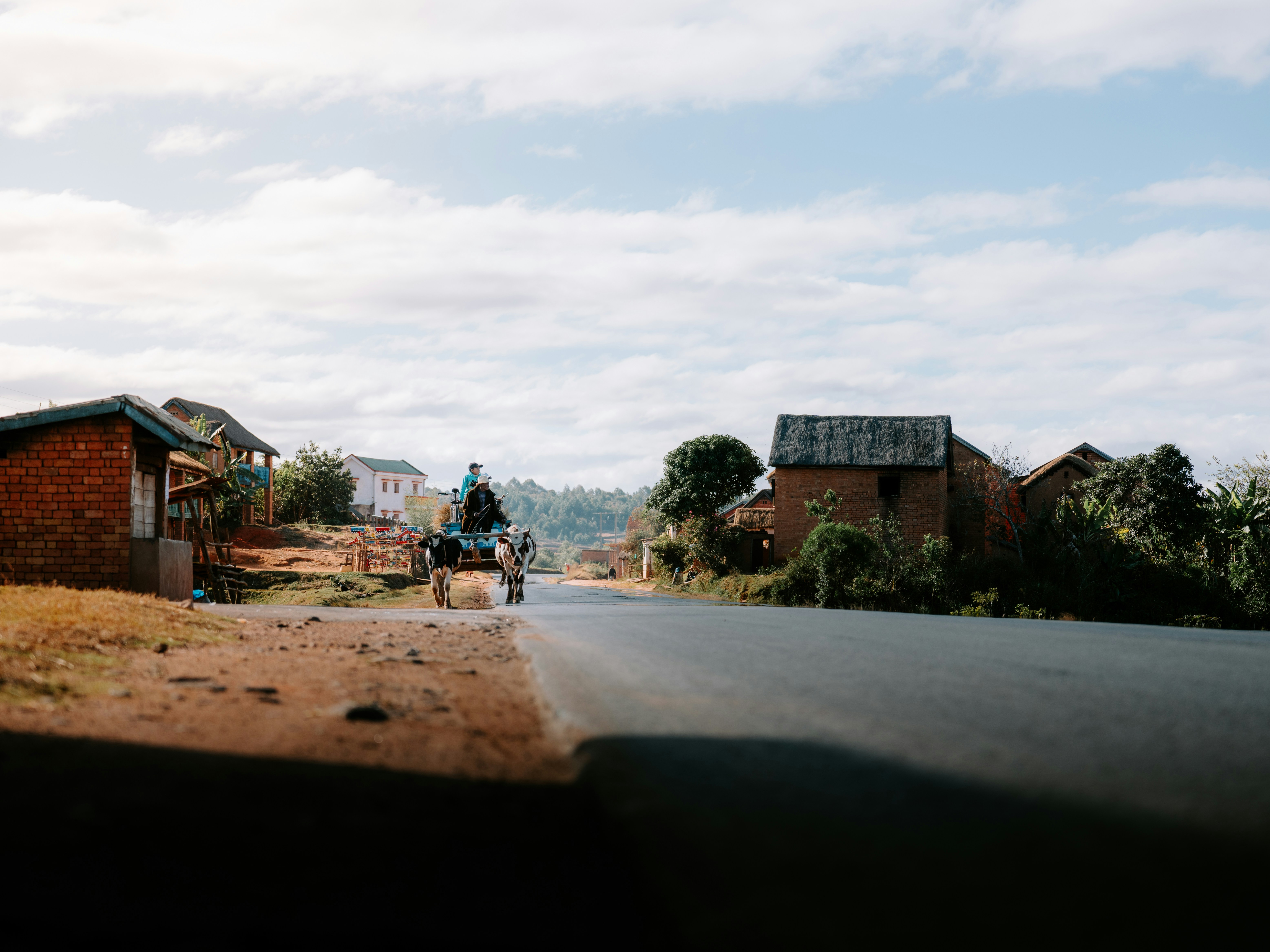 A grand father and grand son on the main road from Antananarivo to Antsirabe, Madagascar.